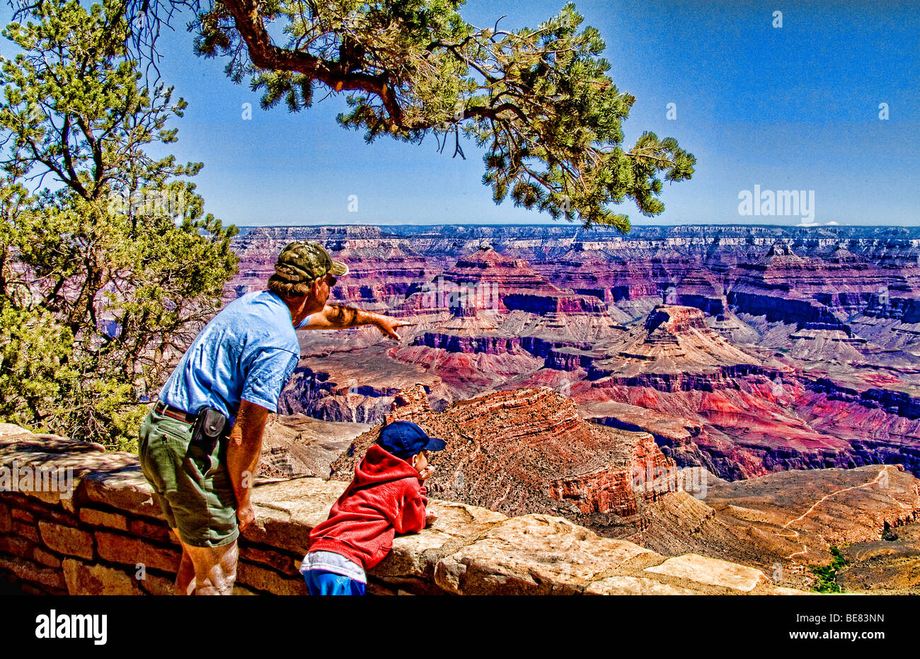 Father showing young son the wonders of the South Rim of the famous ...