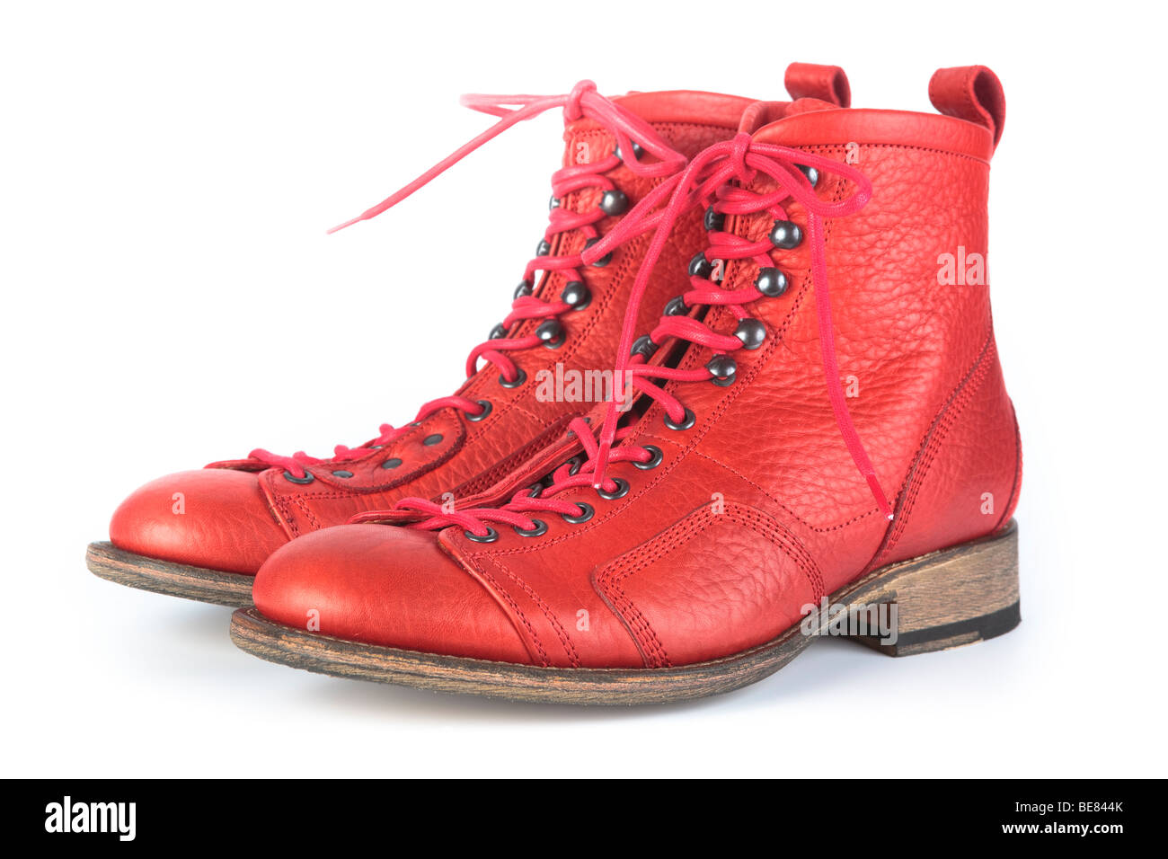 Red shoes with laces on a white background Stock Photo - Alamy