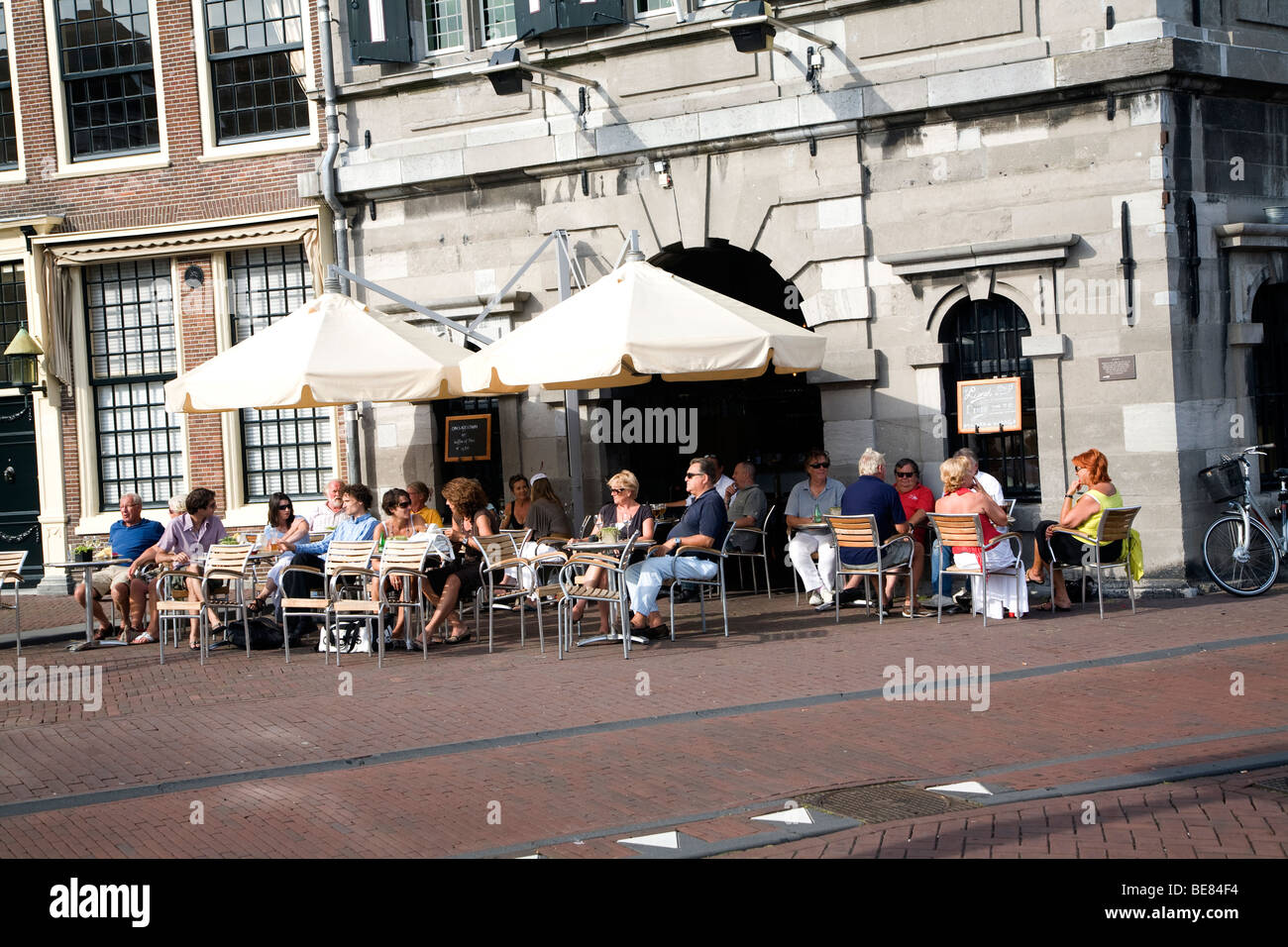 People sitting outside cafe Haarlem Holland Stock Photo - Alamy