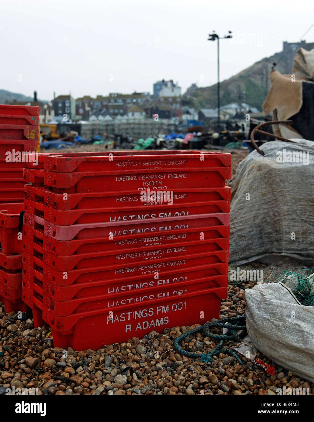 Empty red fish crates on Hastings beach Stock Photo - Alamy