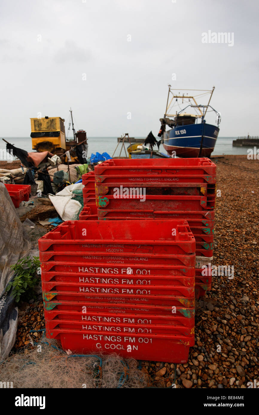 Empty red fish crates on Hastings beach Stock Photo - Alamy