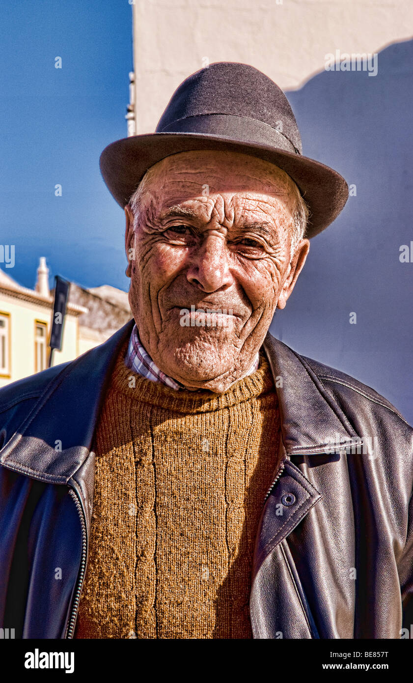 Local man in hat after church in the beautiful Algarve village of Vila ...