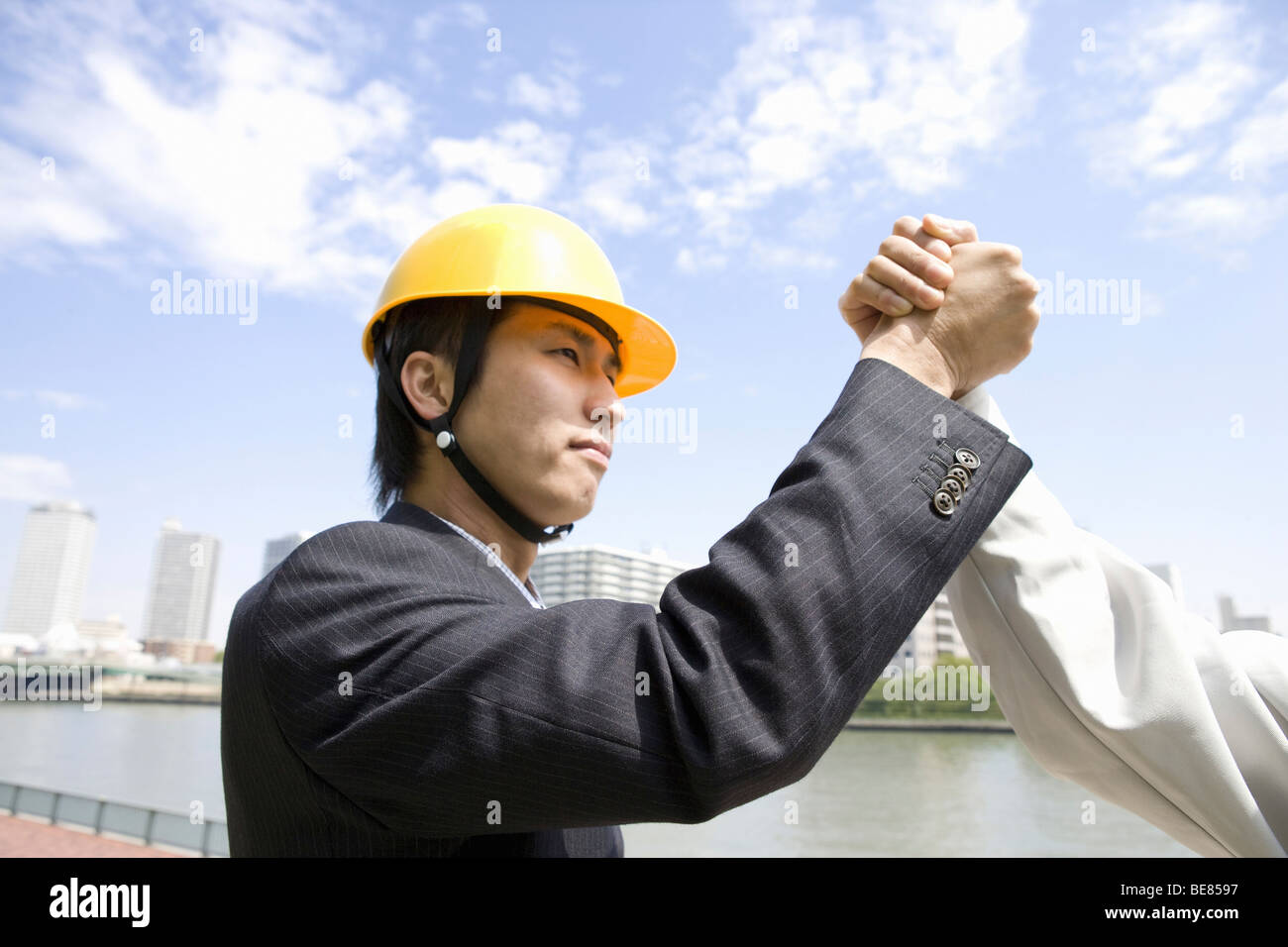 Workman and Businessman Stock Photo - Alamy