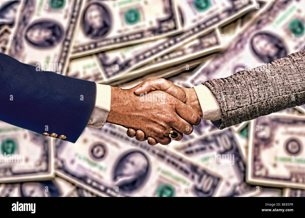 US Paper Currency and Men Shaking Hands Making Deal Stock Photo - Alamy