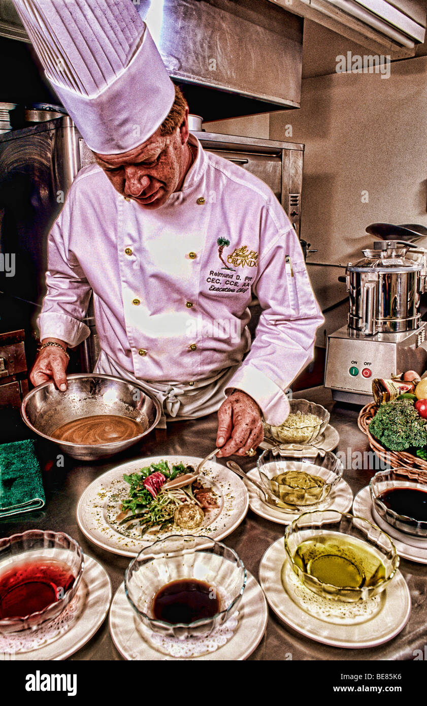 Chef preparing fine meal in fancy restaurant Stock Photo - Alamy