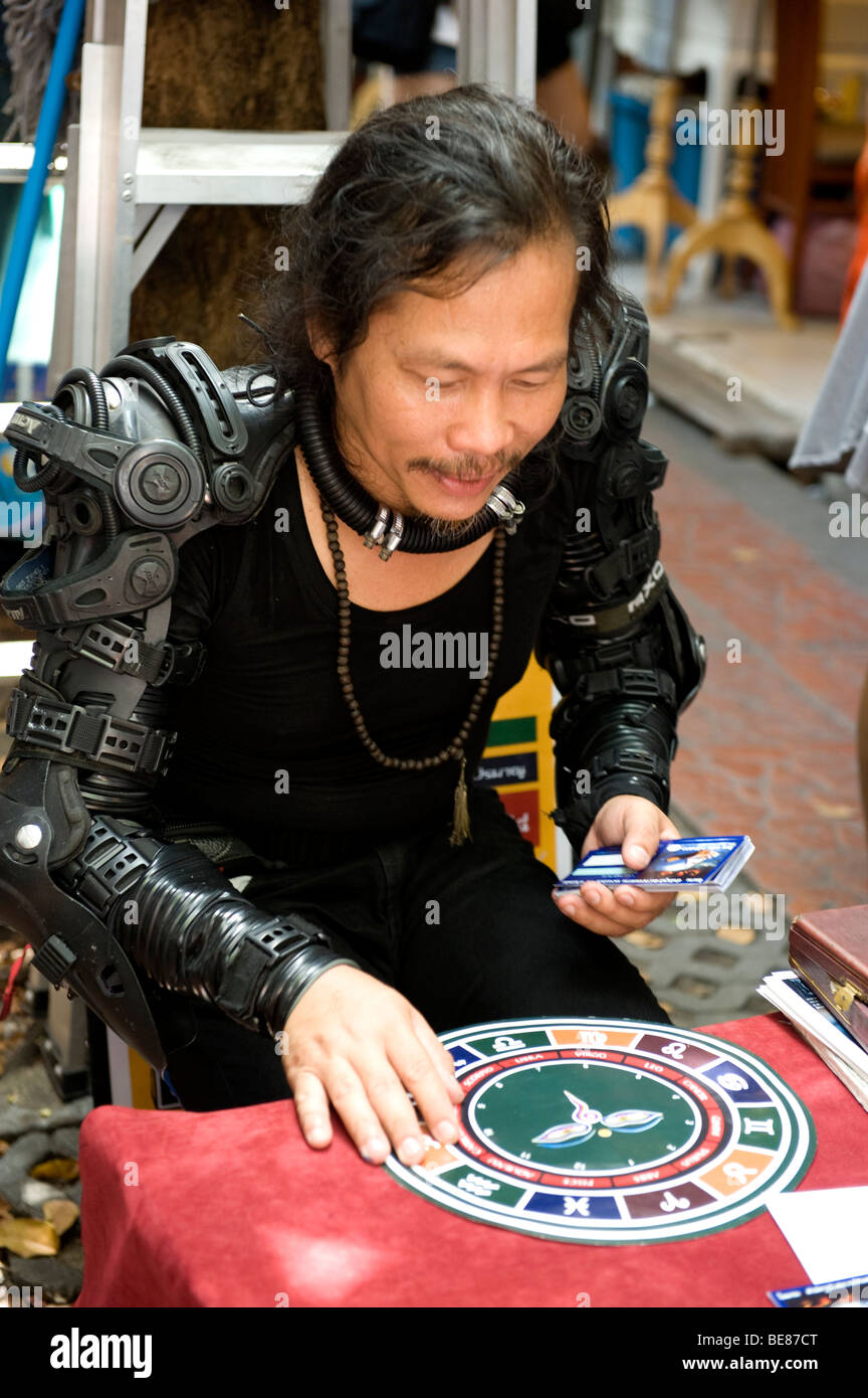a tarot cards fortuneteller with his army suit at chatuchak weekend ...