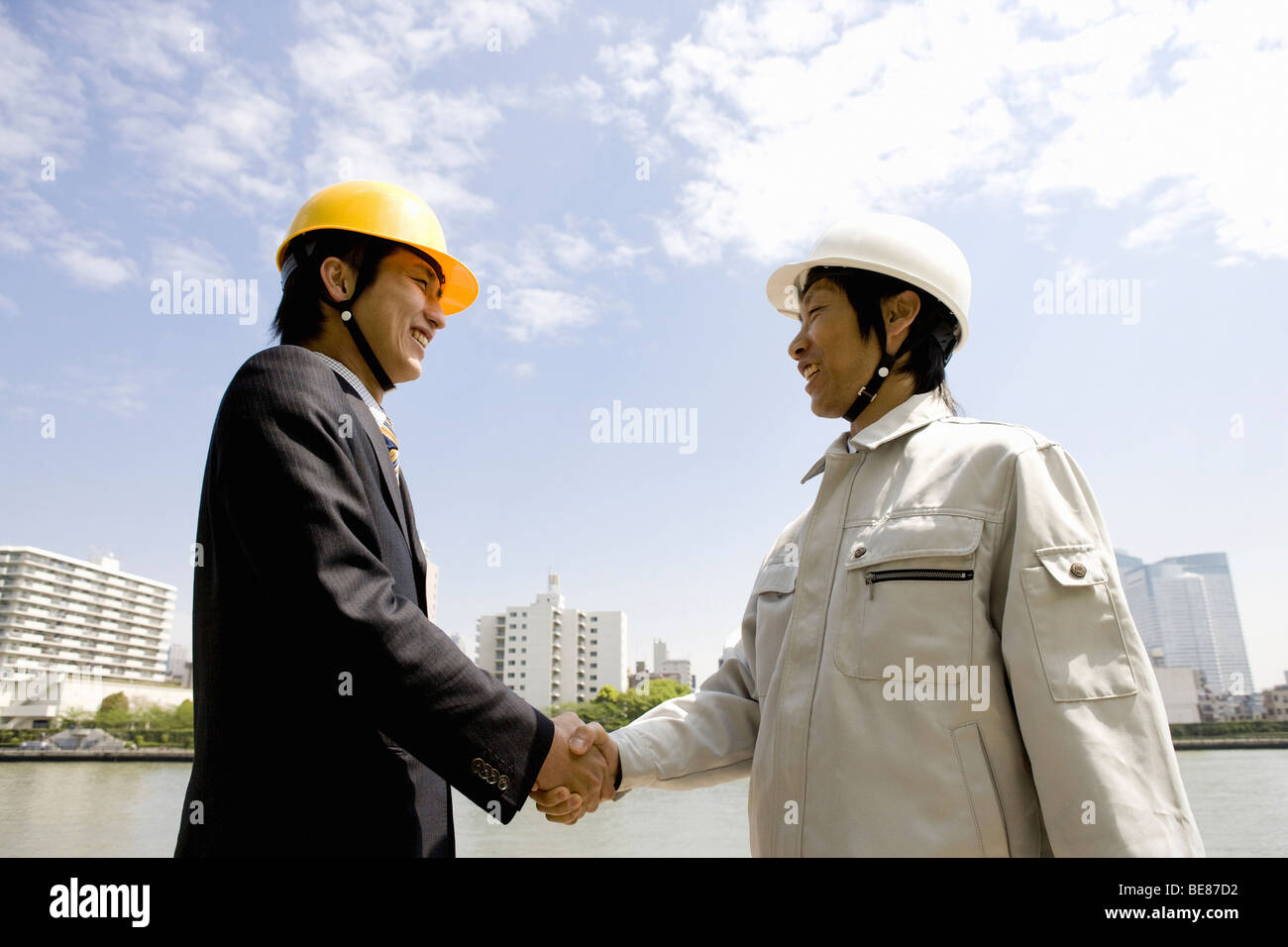 Workman and Businessman Stock Photo - Alamy