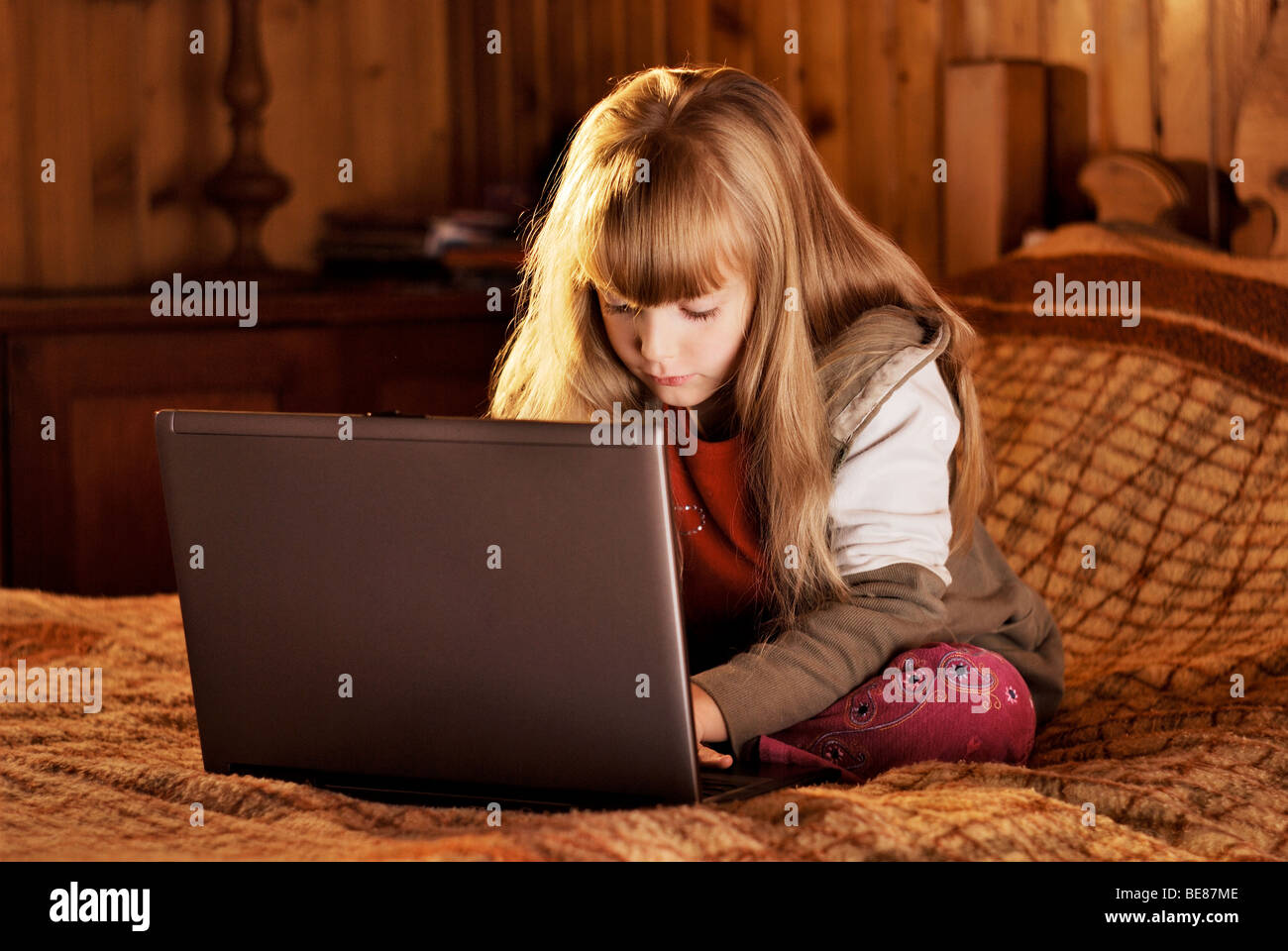 Girl and computer Stock Photo - Alamy