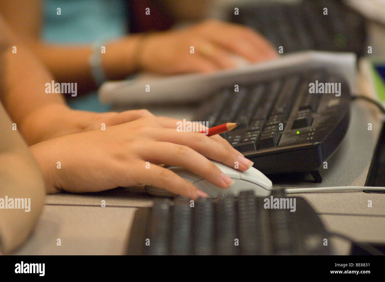 Female hand on mouse Stock Photo - Alamy