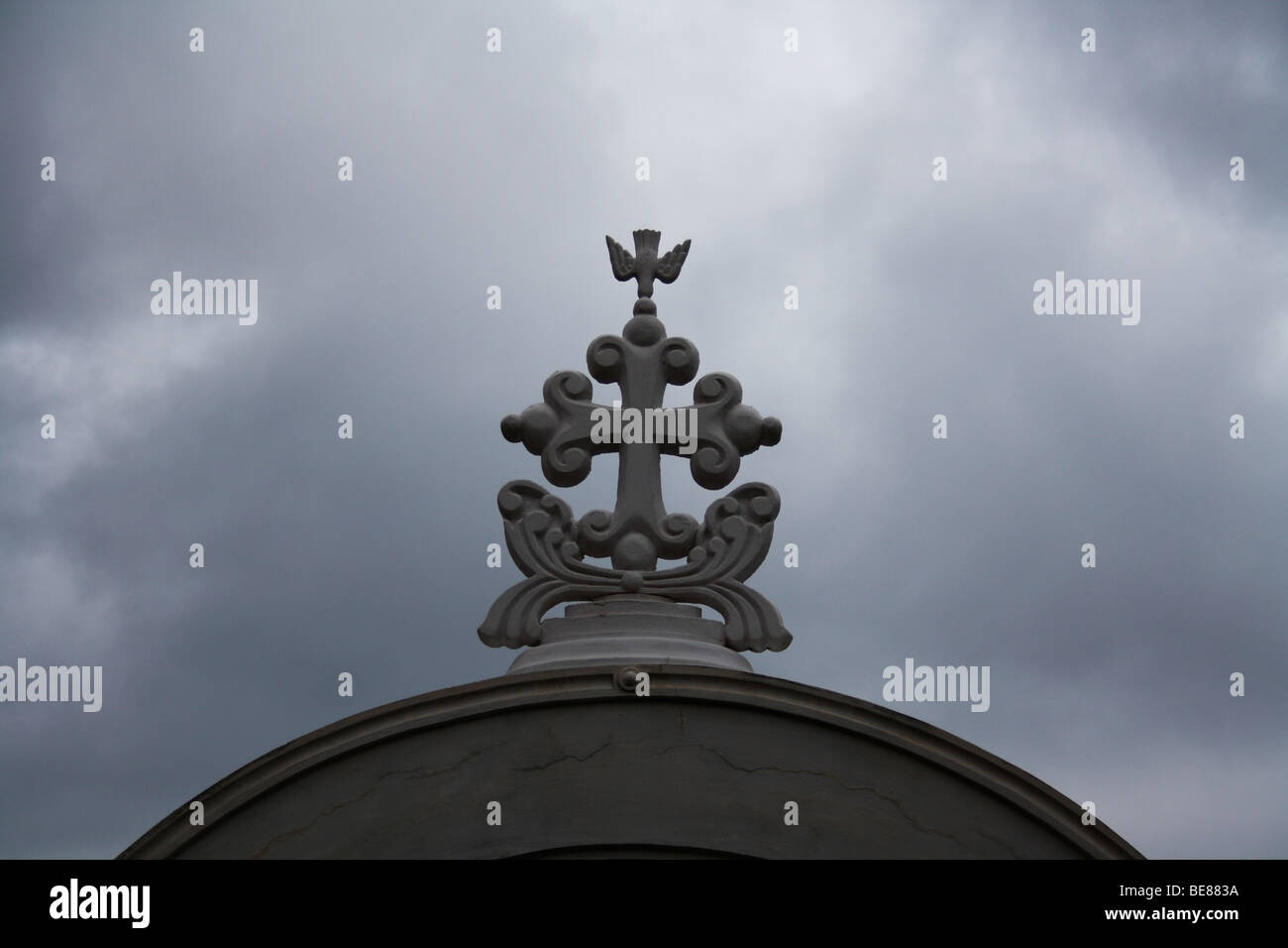 Holy cross with cloudy sky in background, a frequently used religious ...