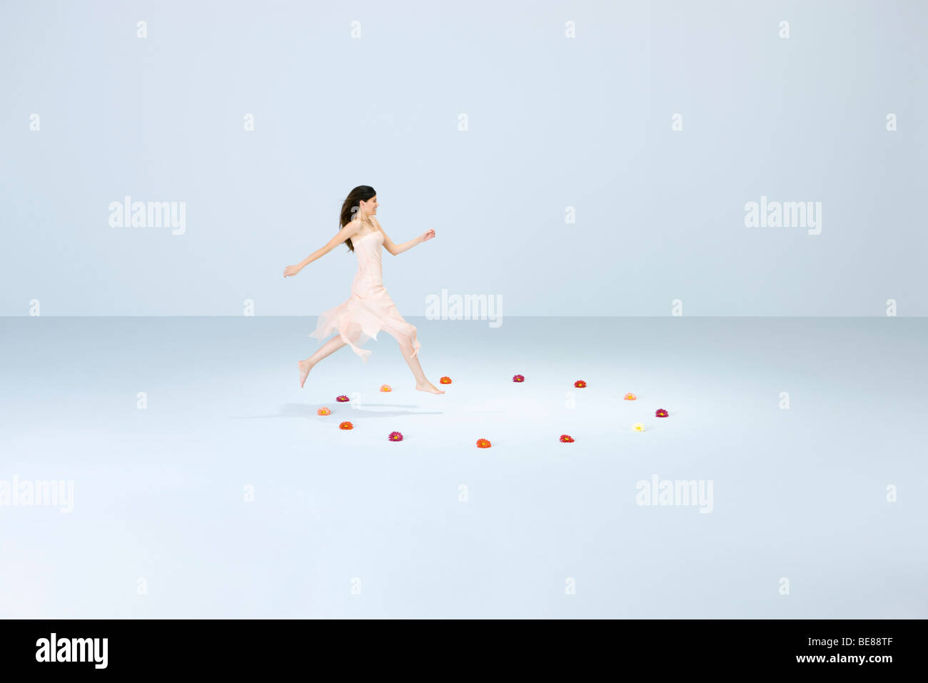 Leaping Woman Dress High Resolution Stock Photography and Images - Alamy