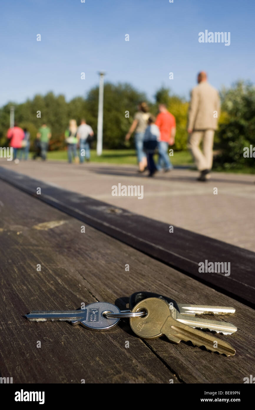 Bunch of keys lying on a bench Stock Photo - Alamy