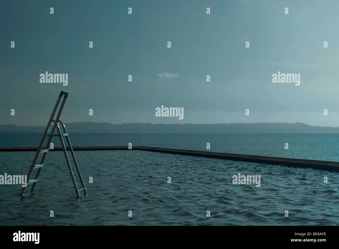 Ladder standing in water Stock Photo - Alamy