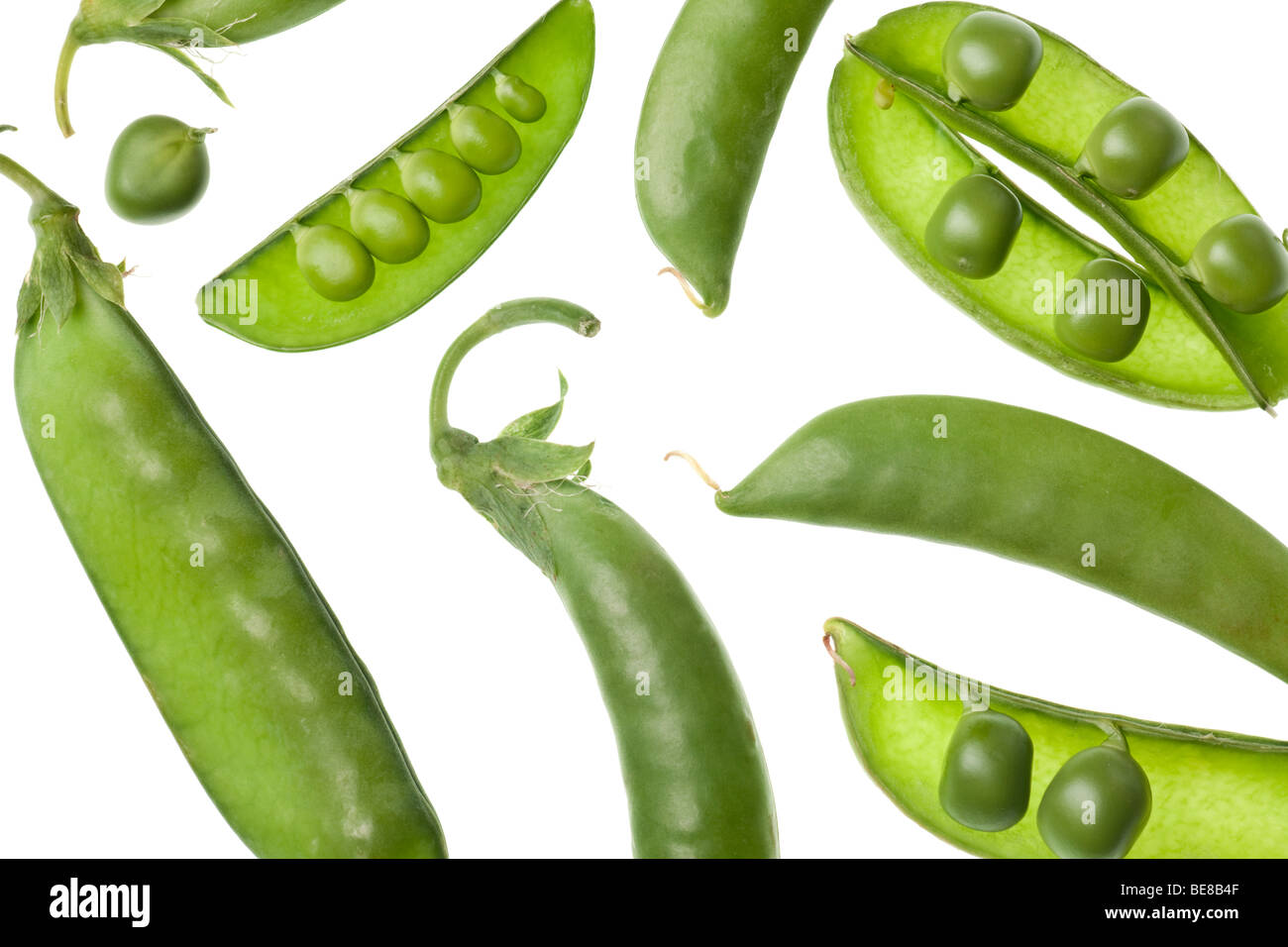 green pea pods isolated on white background Stock Photo - Alamy
