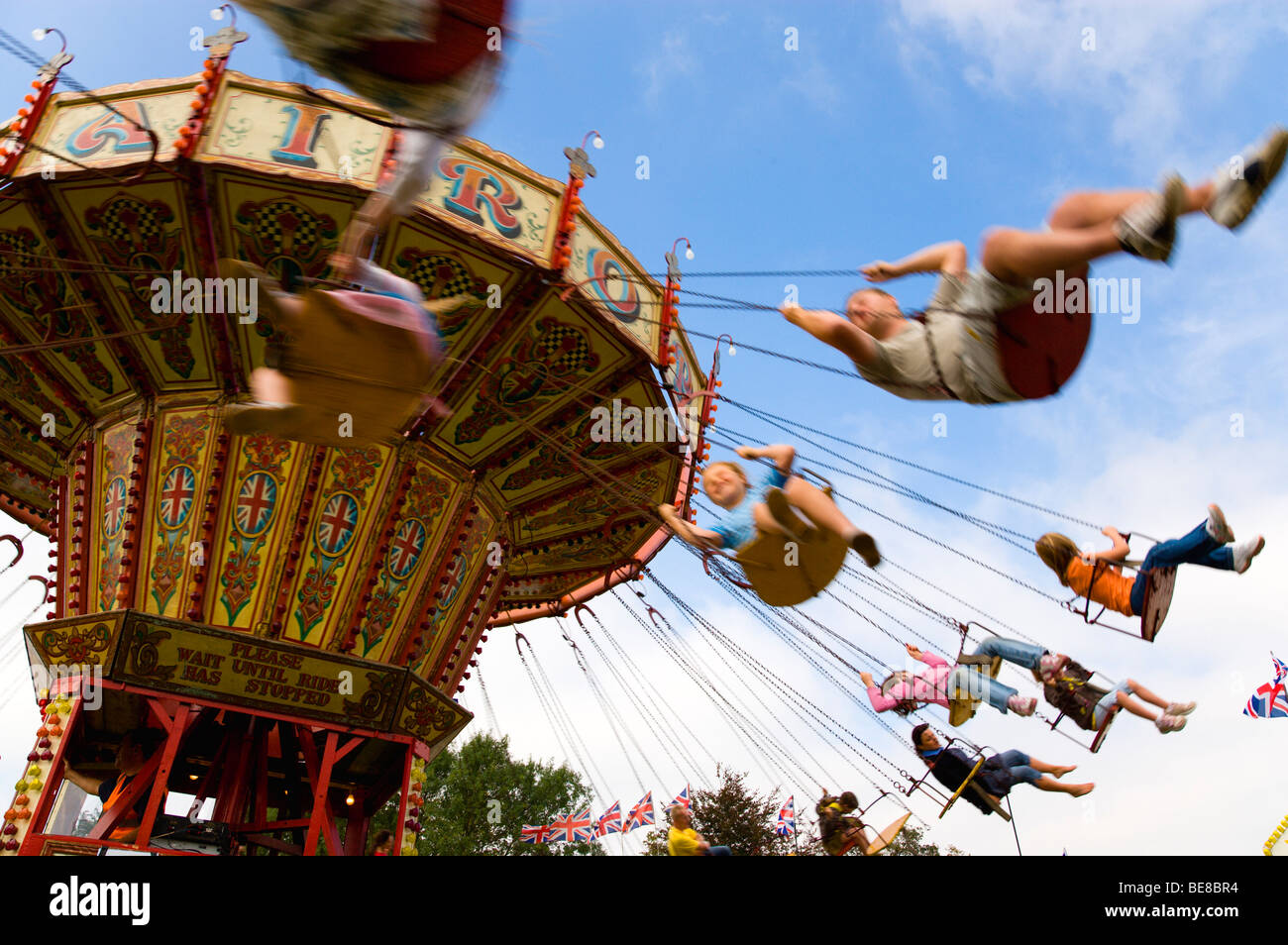England West Sussex Findon Village Sheep Fair Children in motion riding ...