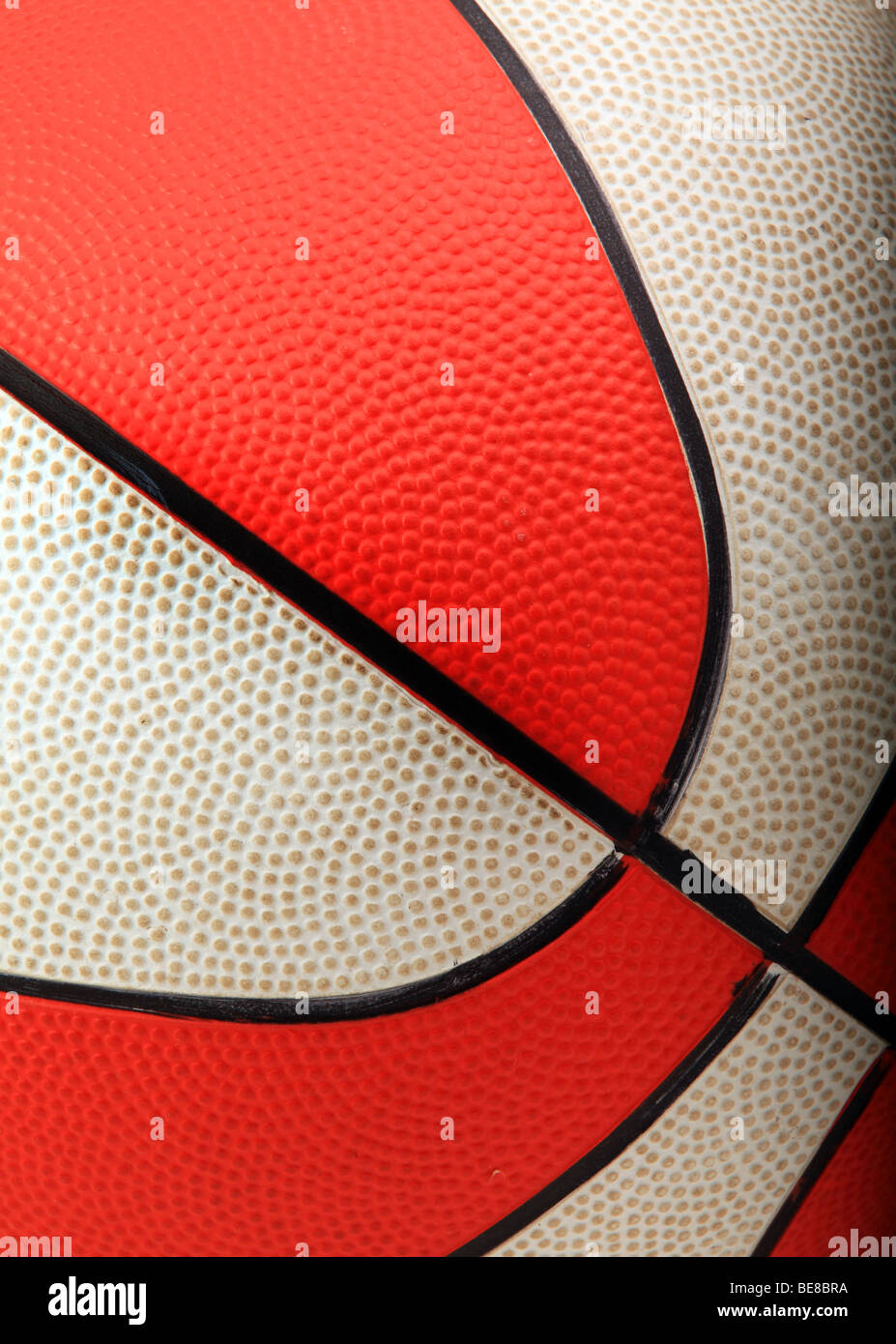 A closeup of an orange and white basketball Stock Photo - Alamy