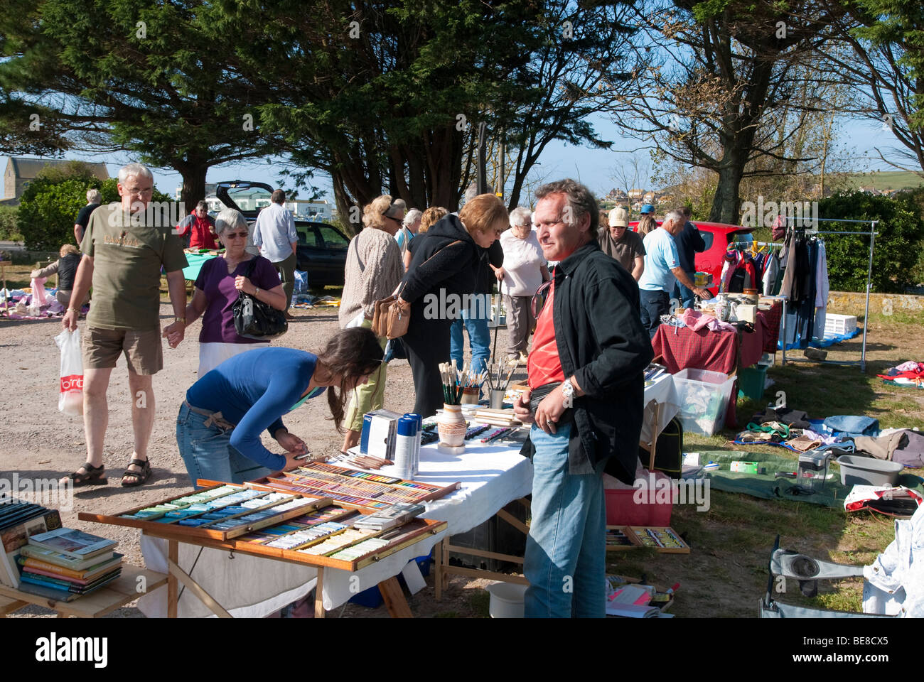 Traders and customers at a Sunday car boot sale in West Bay, Dorset ...