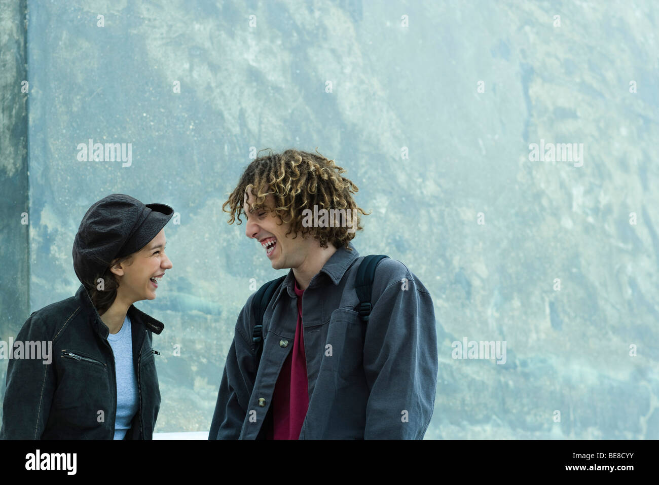 Young couple laughing together Stock Photo - Alamy