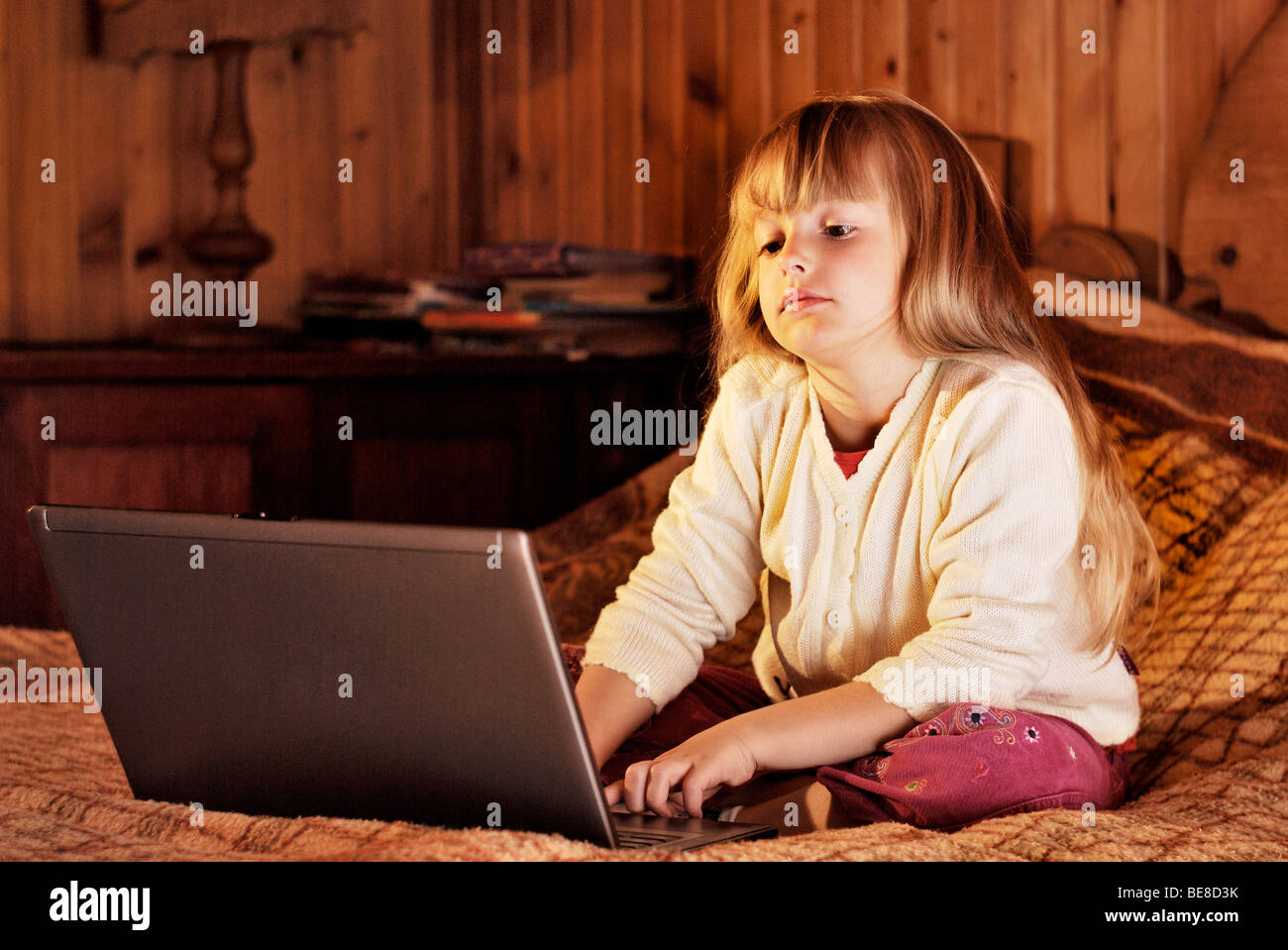 Girl and computer Stock Photo - Alamy