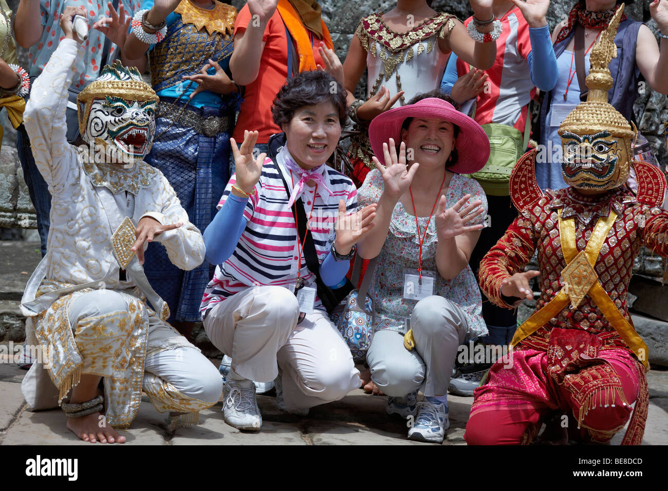 Angkor Wat dancer. Japanese Tourists posing with the local dance troupe ...