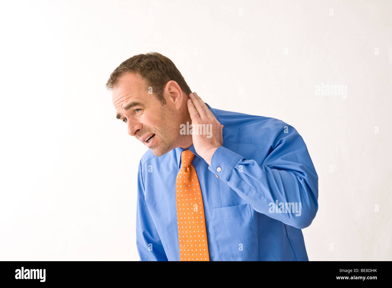 Man wearing tie and shirt, hand on his aching neck Stock Photo - Alamy