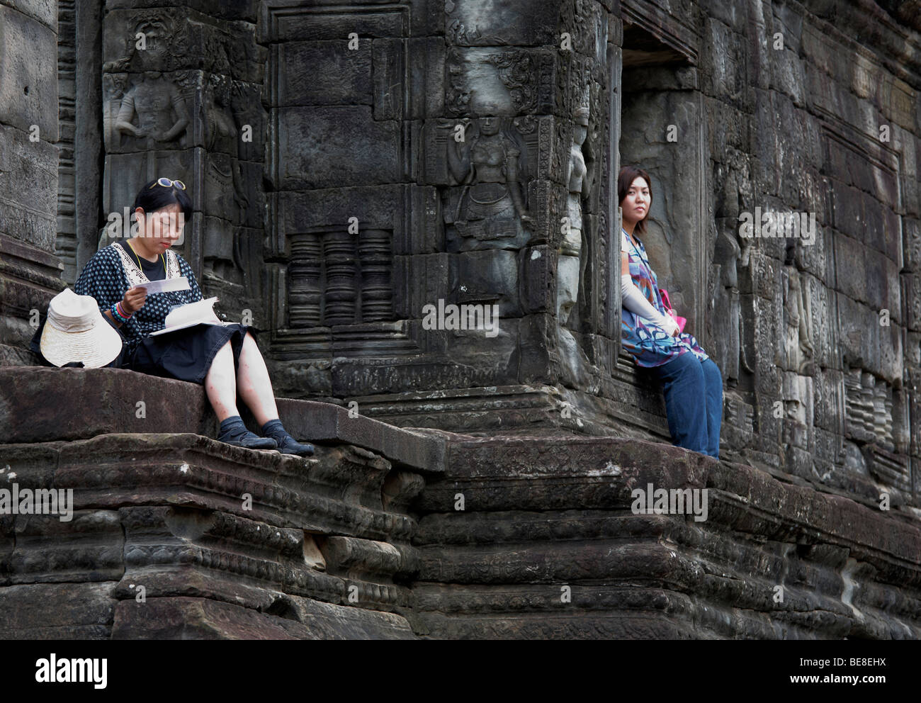 Women sitting on temple steps hi-res stock photography and images - Alamy