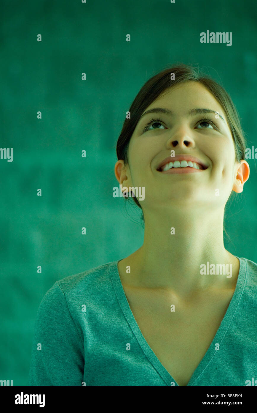 Young woman looking up smiling Stock Photo - Alamy