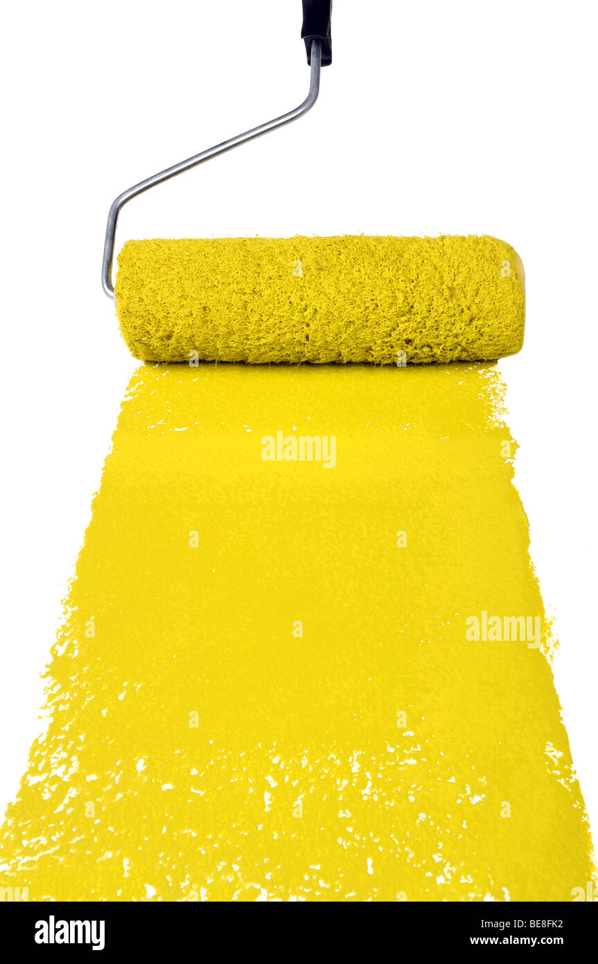 Paint roller With yellow paint isolated over white background Stock ...