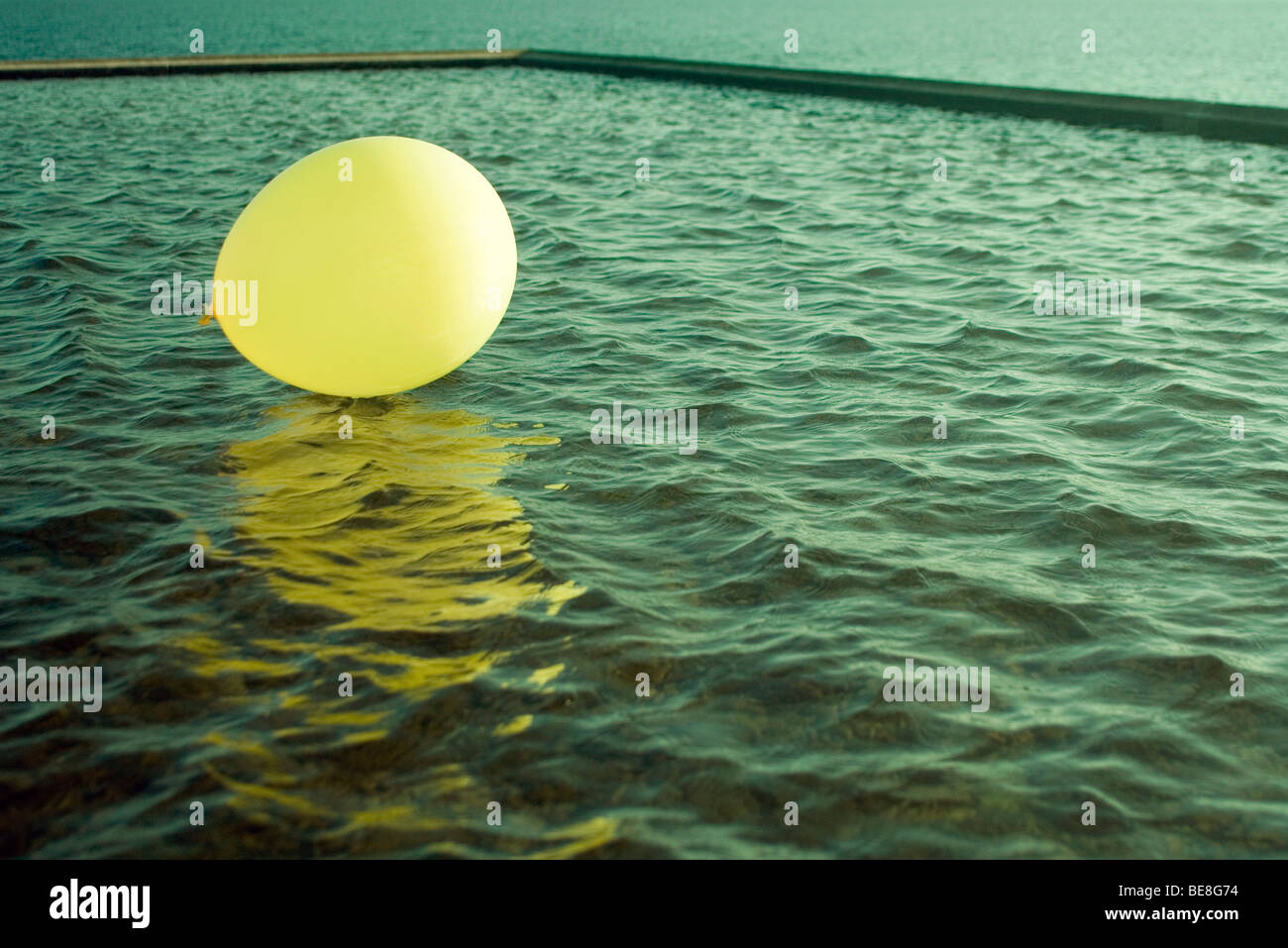Balloon on rippled water surface Stock Photo - Alamy