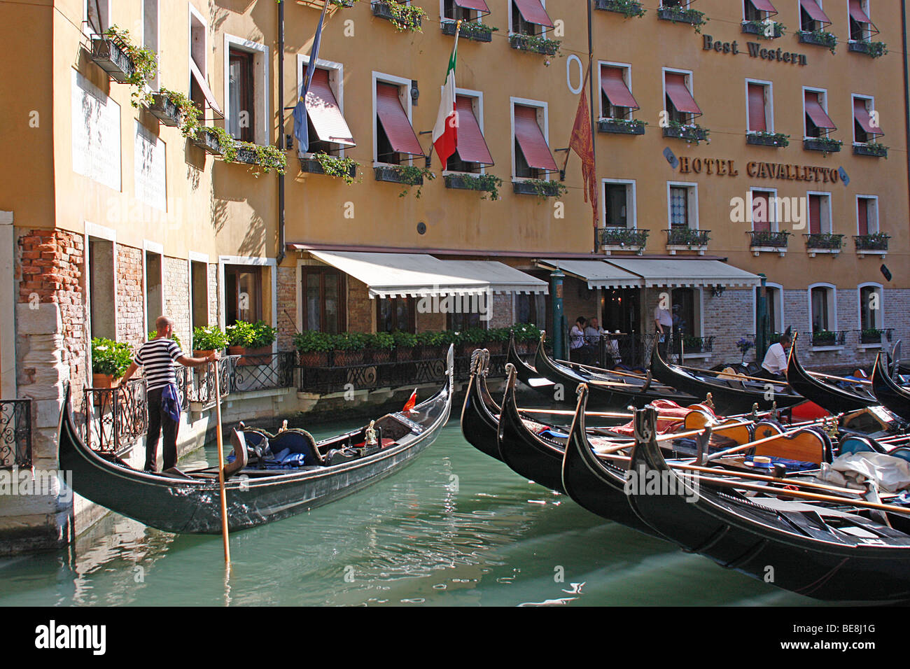 Gondoliers take tourists to Venice on a boat ride through the wonderful ...