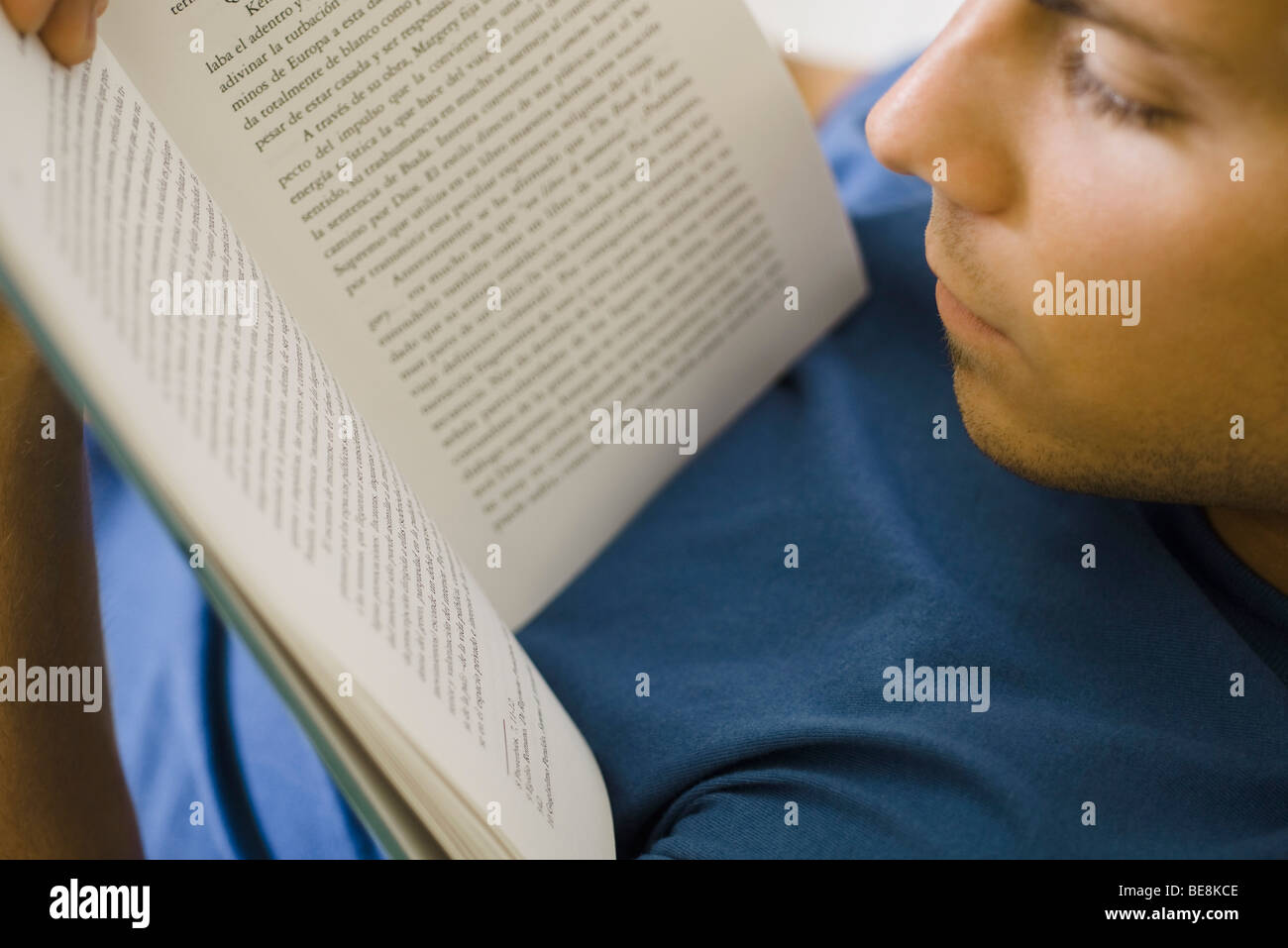 Man reading book Stock Photo - Alamy