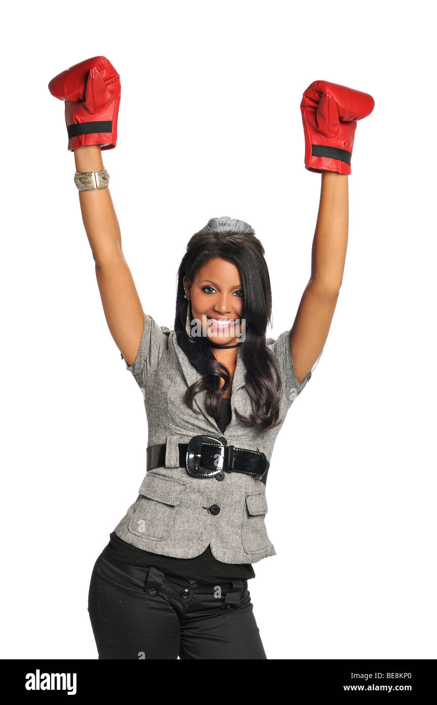 Woman expressing victory wearing boxing gloves isolated on a white ...