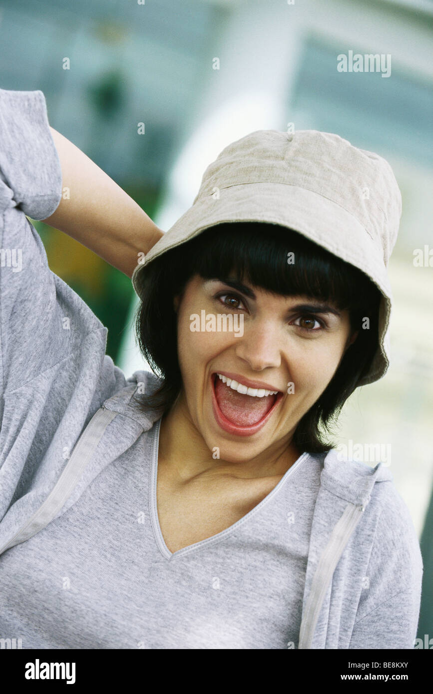 Woman smiling with looking of astonishment, portrait Stock Photo - Alamy