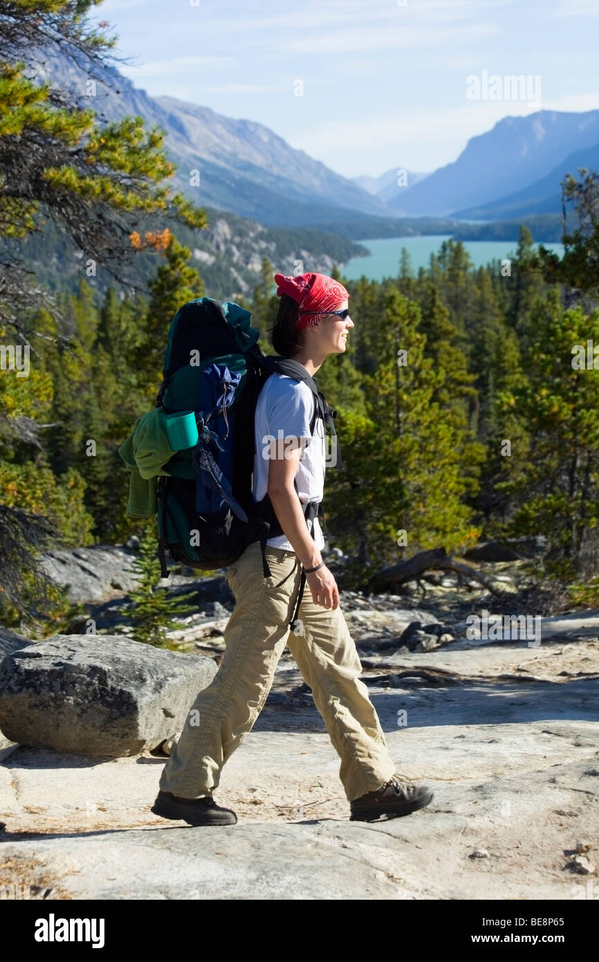 Young woman hiking, backpacking, hiker with backpack, historic Chilkoot ...