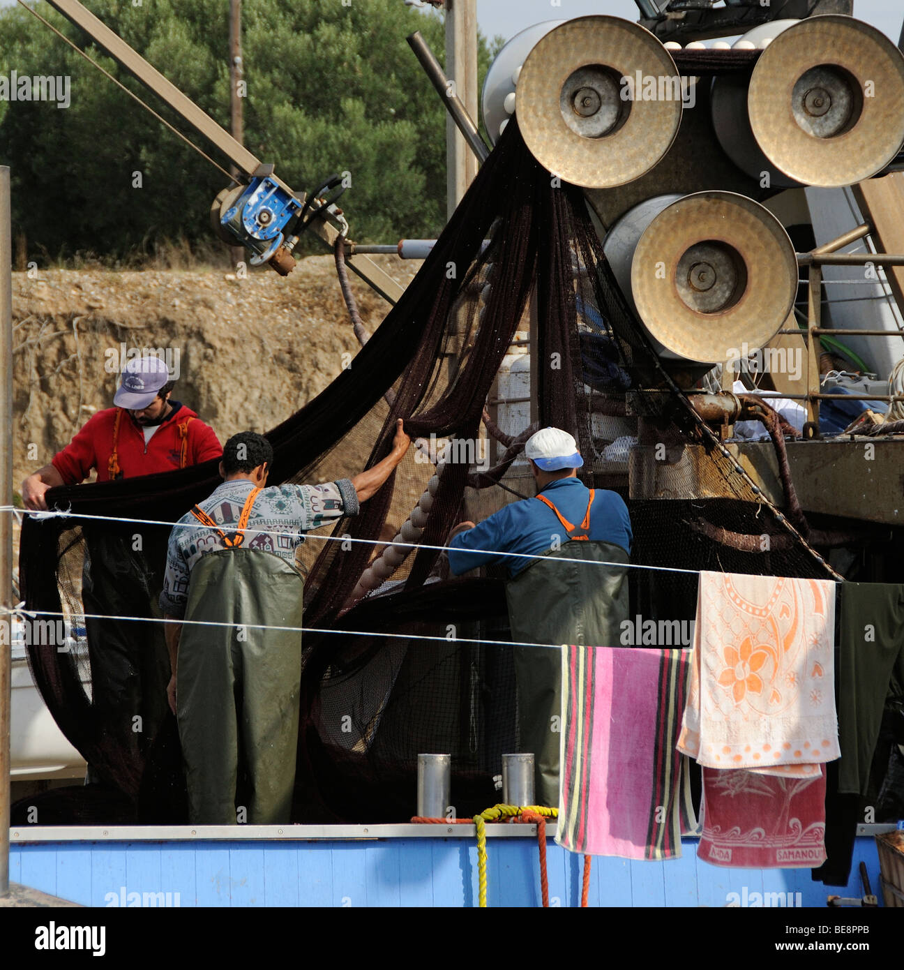 Fisherman sorting nets hi-res stock photography and images - Alamy