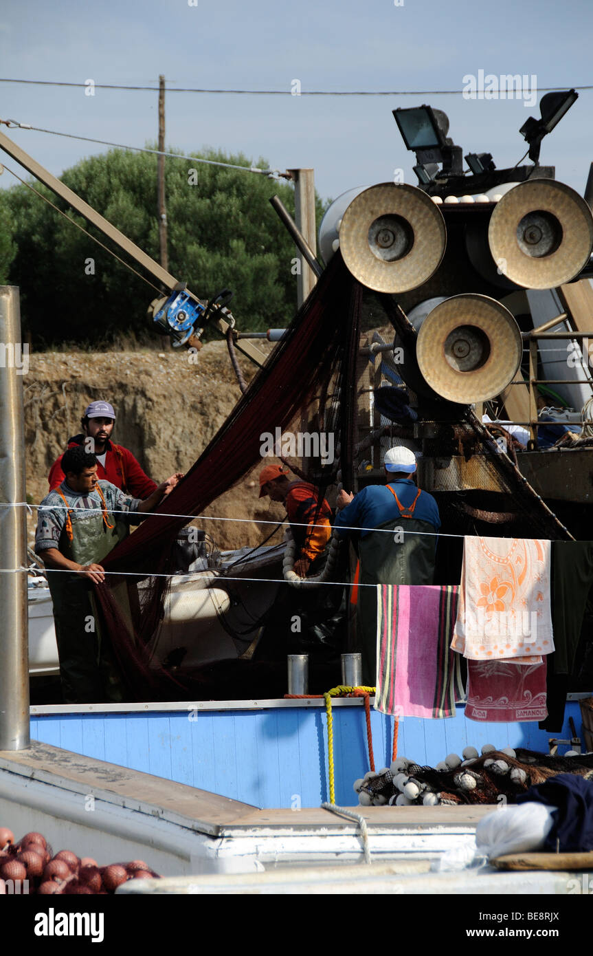 Fishermen checking their fishing nets hi-res stock photography and images - Alamy