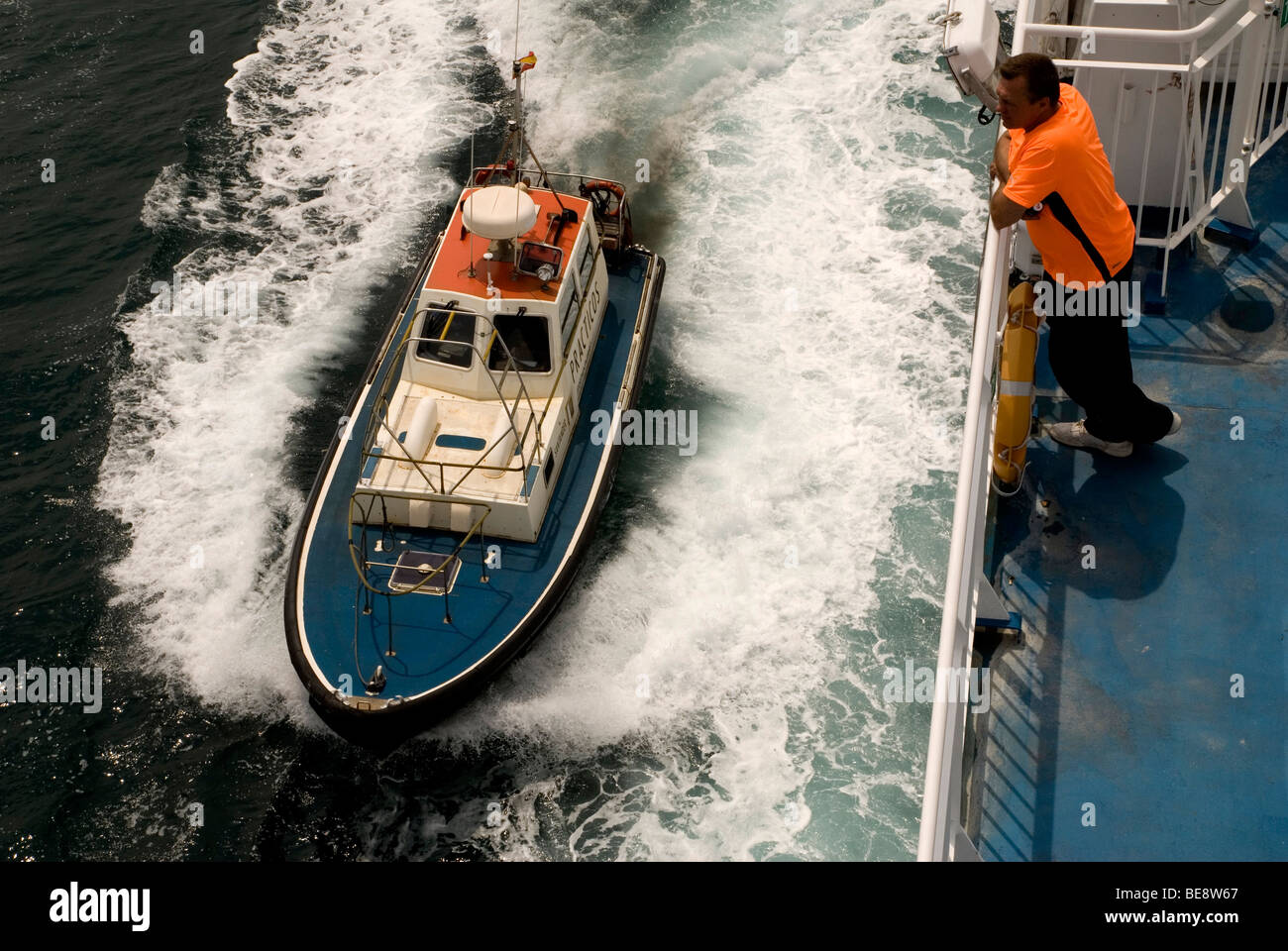 A Santander coastguard vessel escorts the Brittany Ferries ship ...