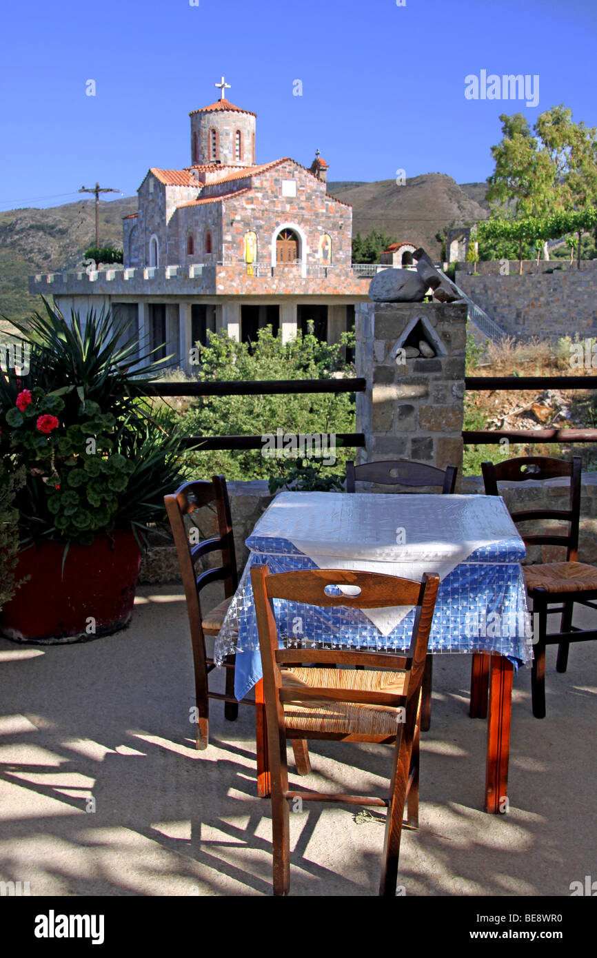 Taverna overlooking the church, mountain village of Axos, Crete, Greece ...