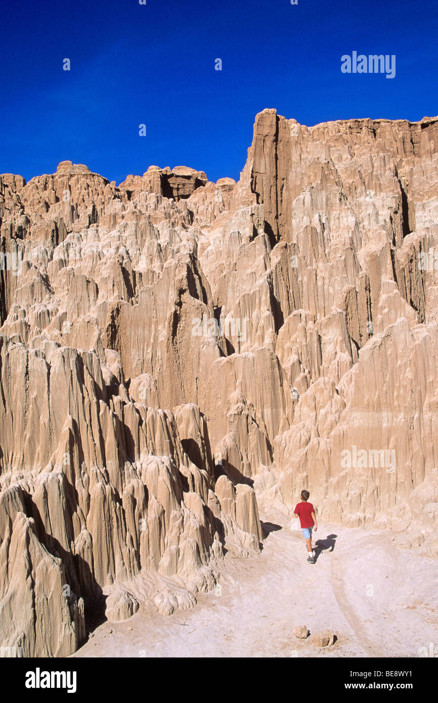 Cathedral Gorge State Park, boy hikes among eroded spires, near Panaca ...