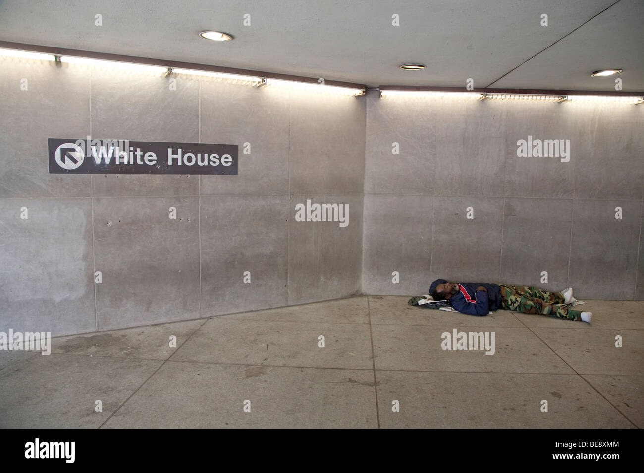Washington, DC - A homeless man sleeps at the entrance to a Metro ...