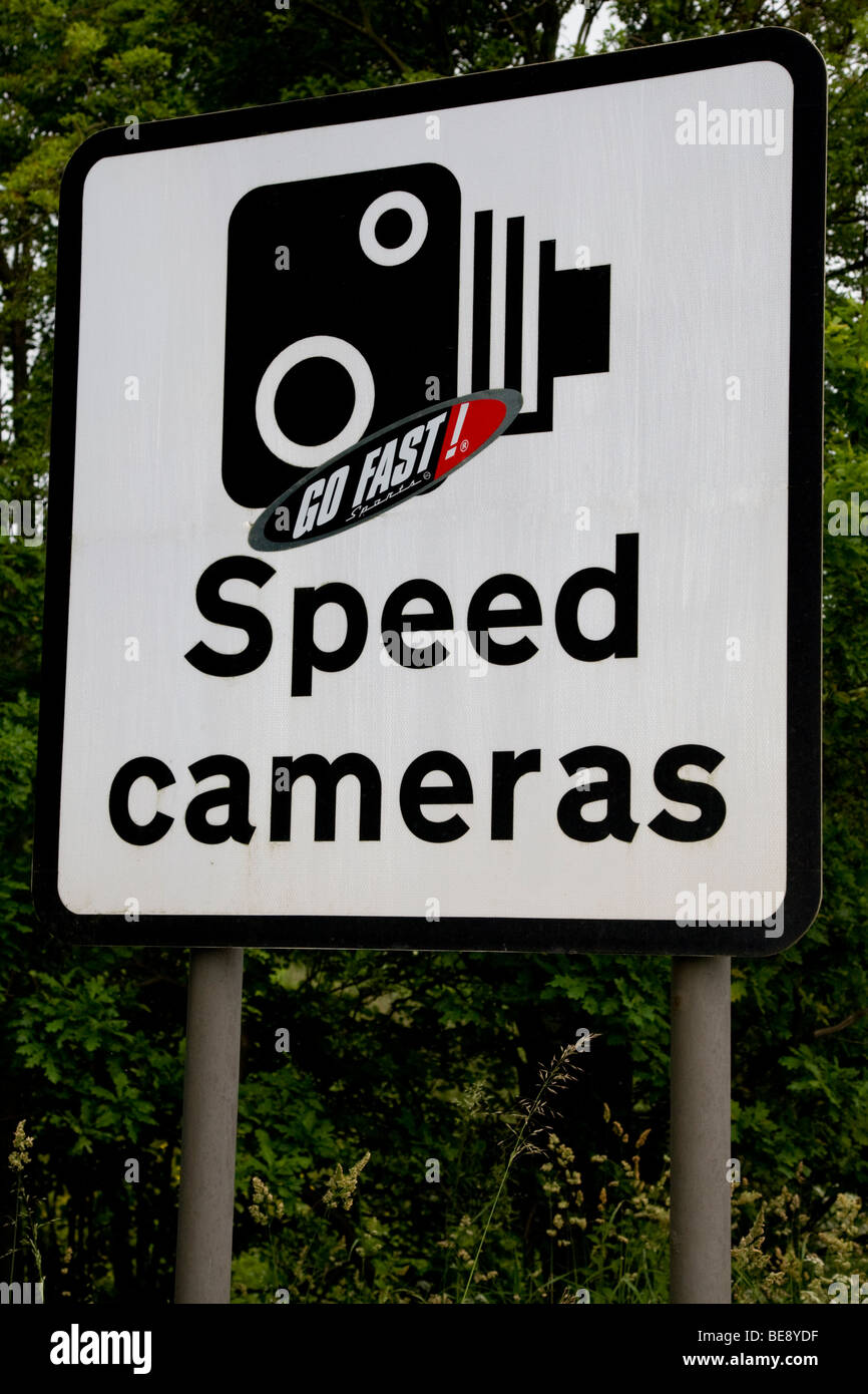 Speed camera sign with the exhortation to go fast! Stock Photo - Alamy