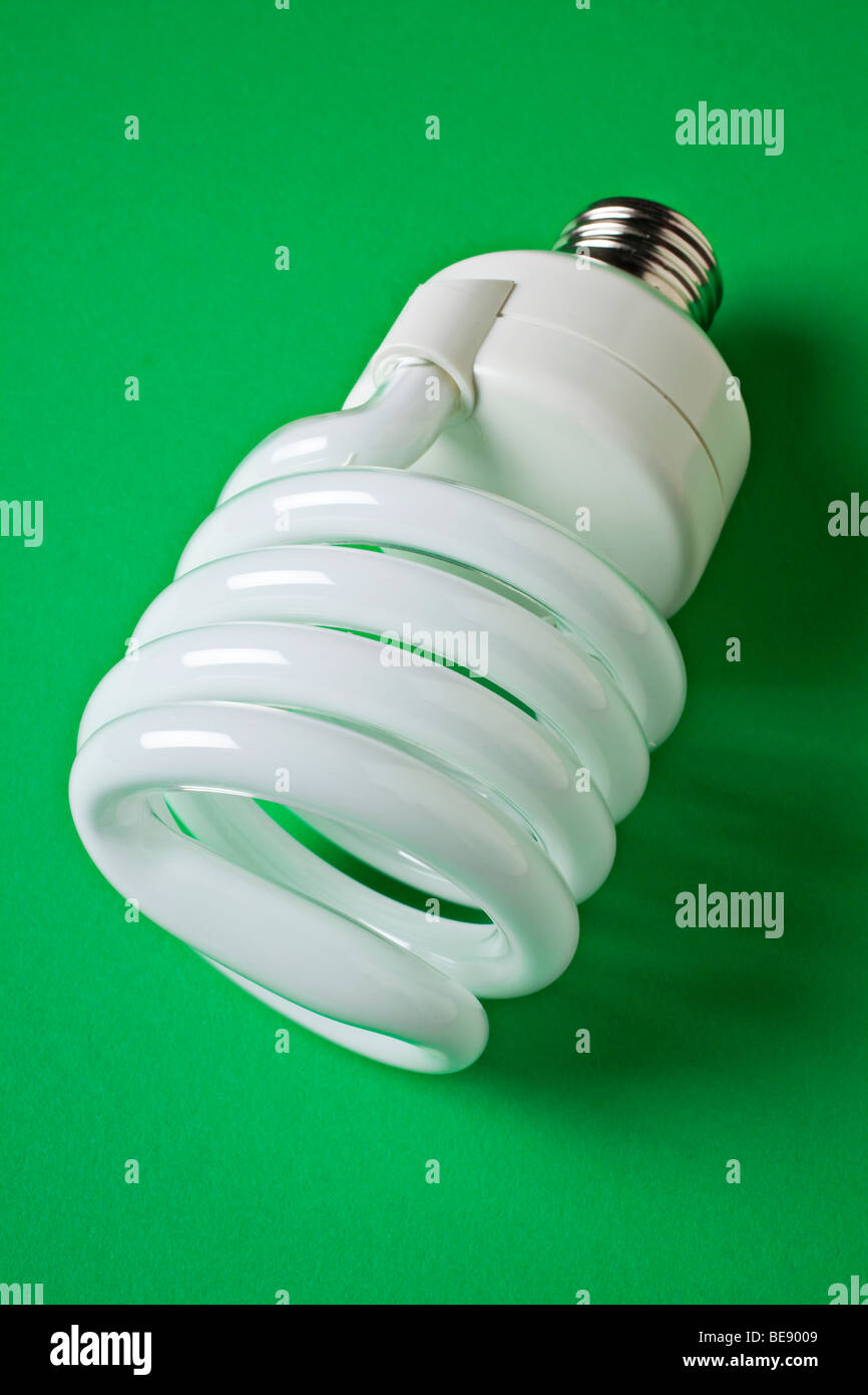 Energy light bulb on green background Stock Photo - Alamy