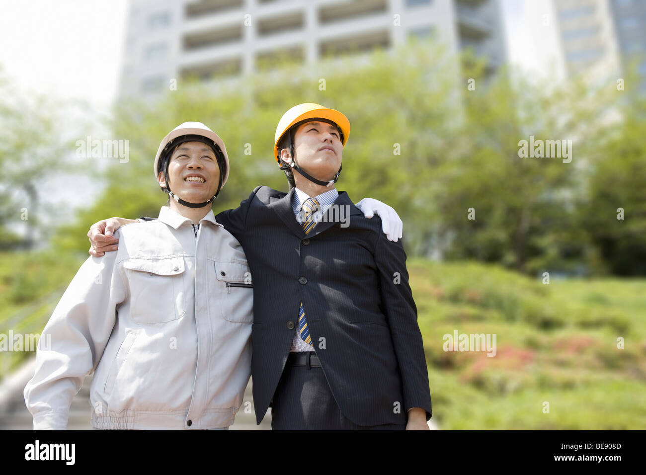 Workman and Businessman Stock Photo - Alamy