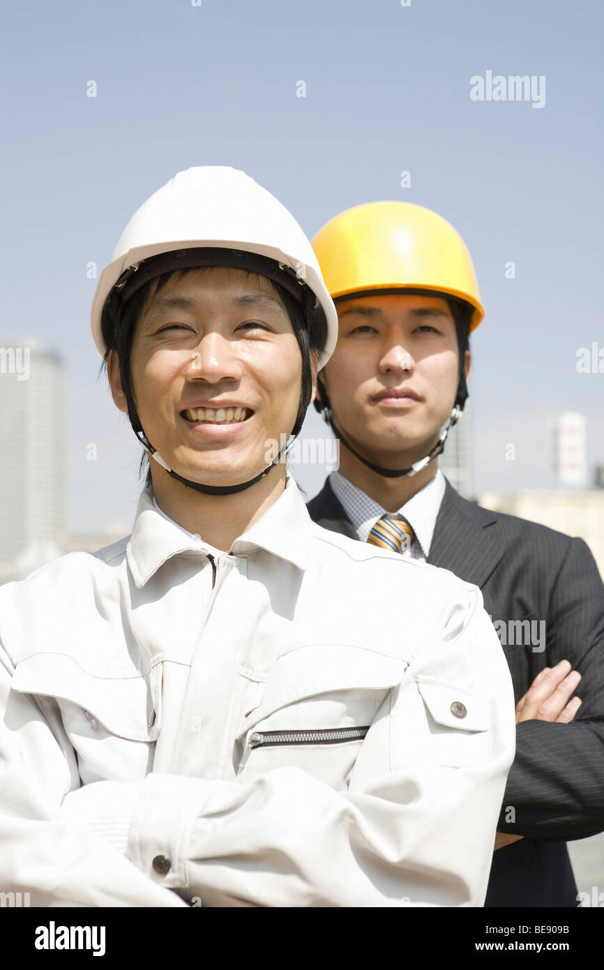 Workman and Businessman Stock Photo - Alamy