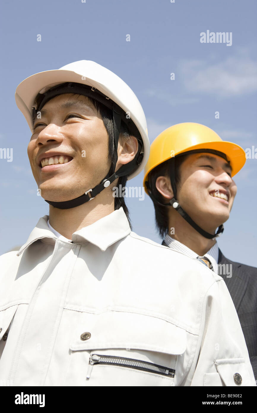 Workman and Businessman Stock Photo - Alamy