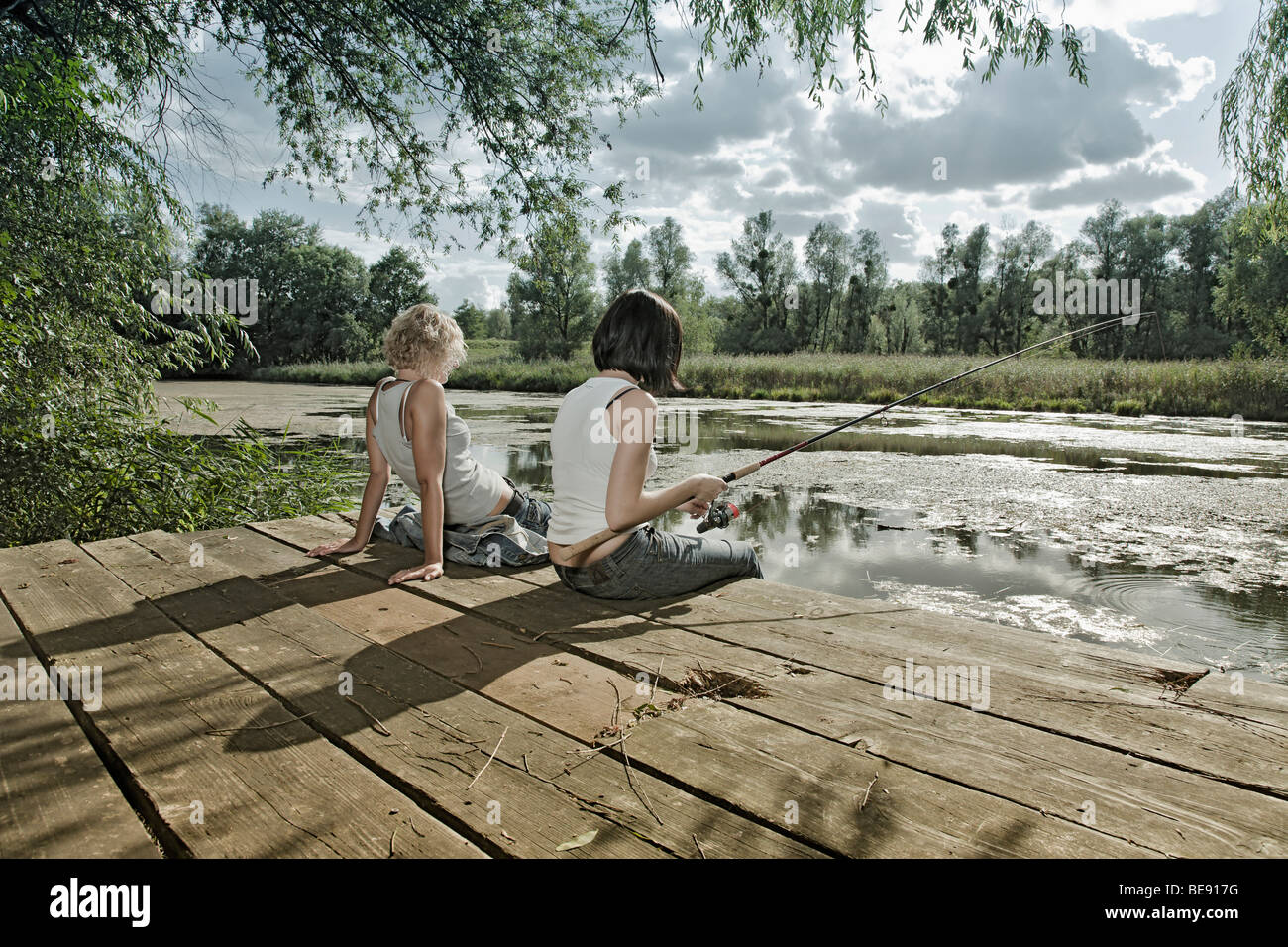 Two Hold Fishing Rods High Resolution Stock Photography and Images - Alamy