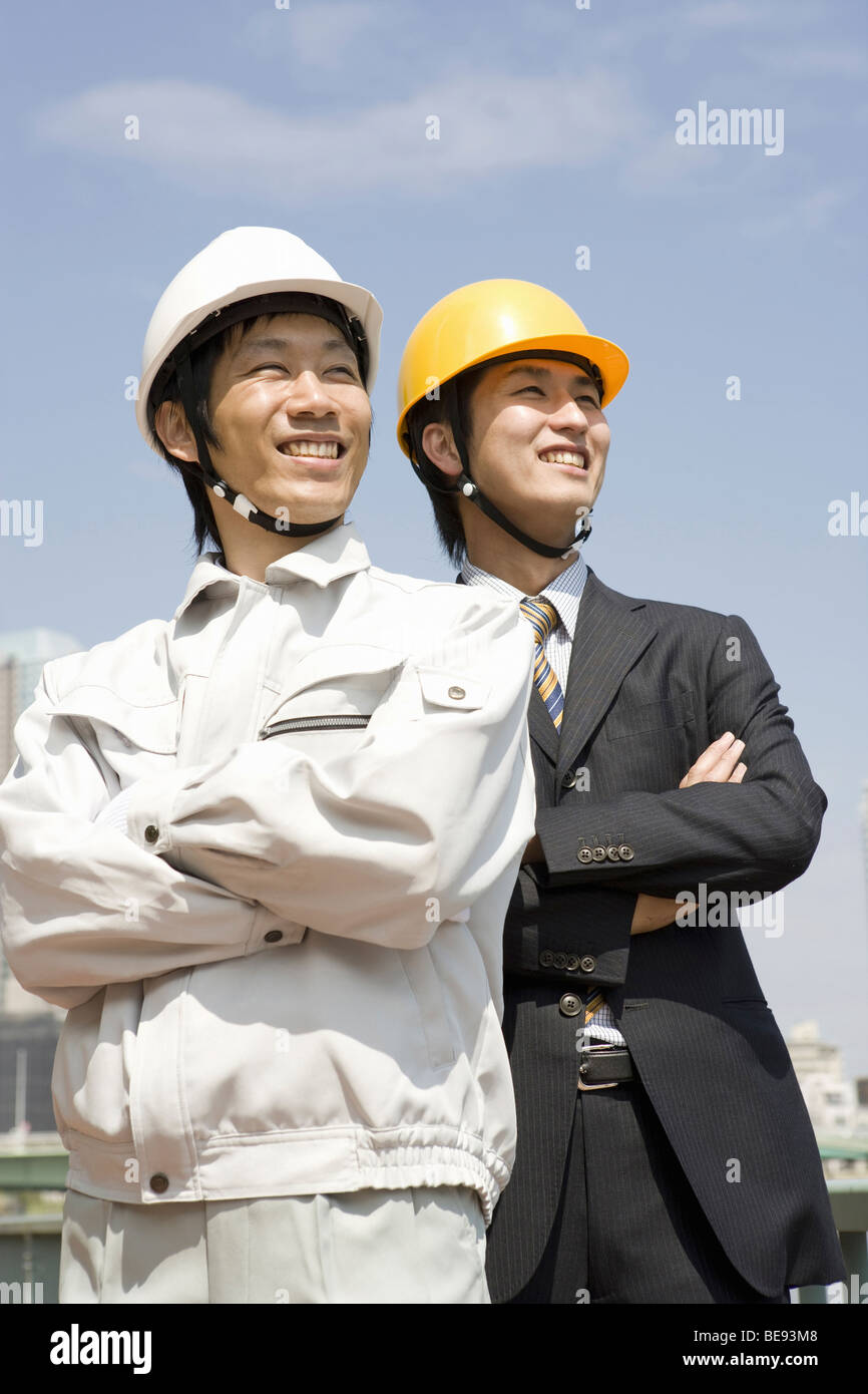 Workman and Businessman Stock Photo - Alamy