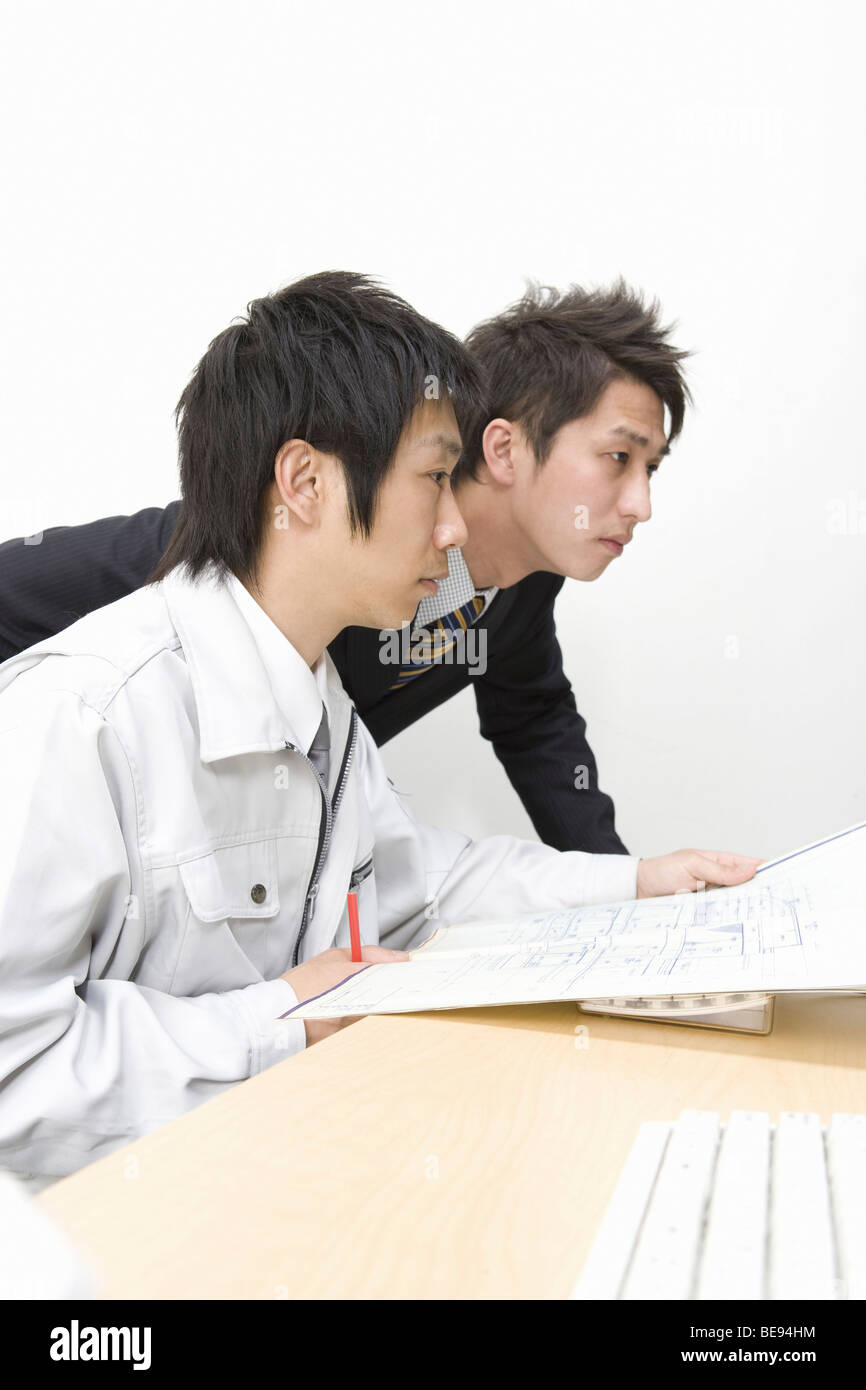 Workman and Businessman Stock Photo - Alamy