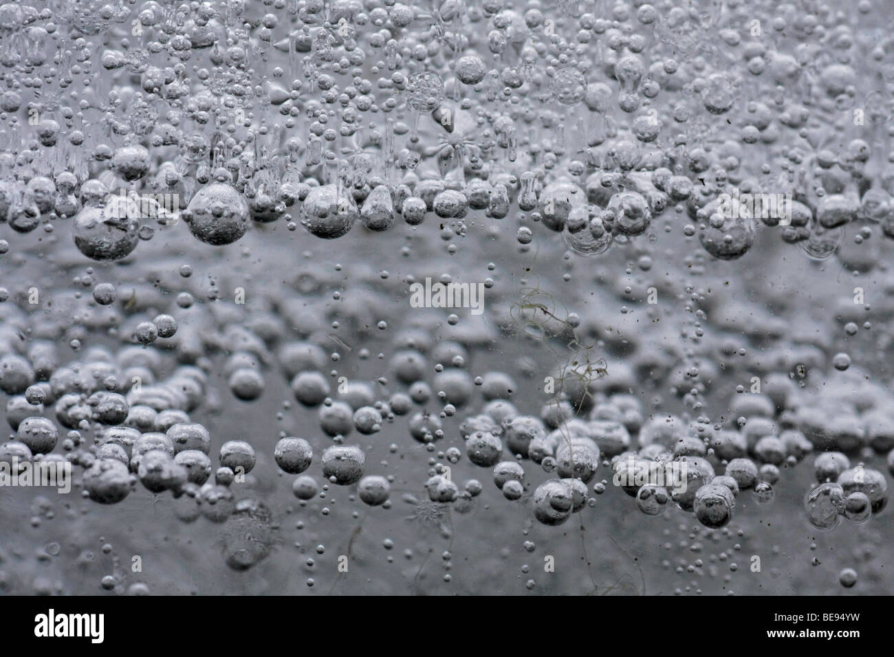 Bubbles into ice, side view Stock Photo - Alamy
