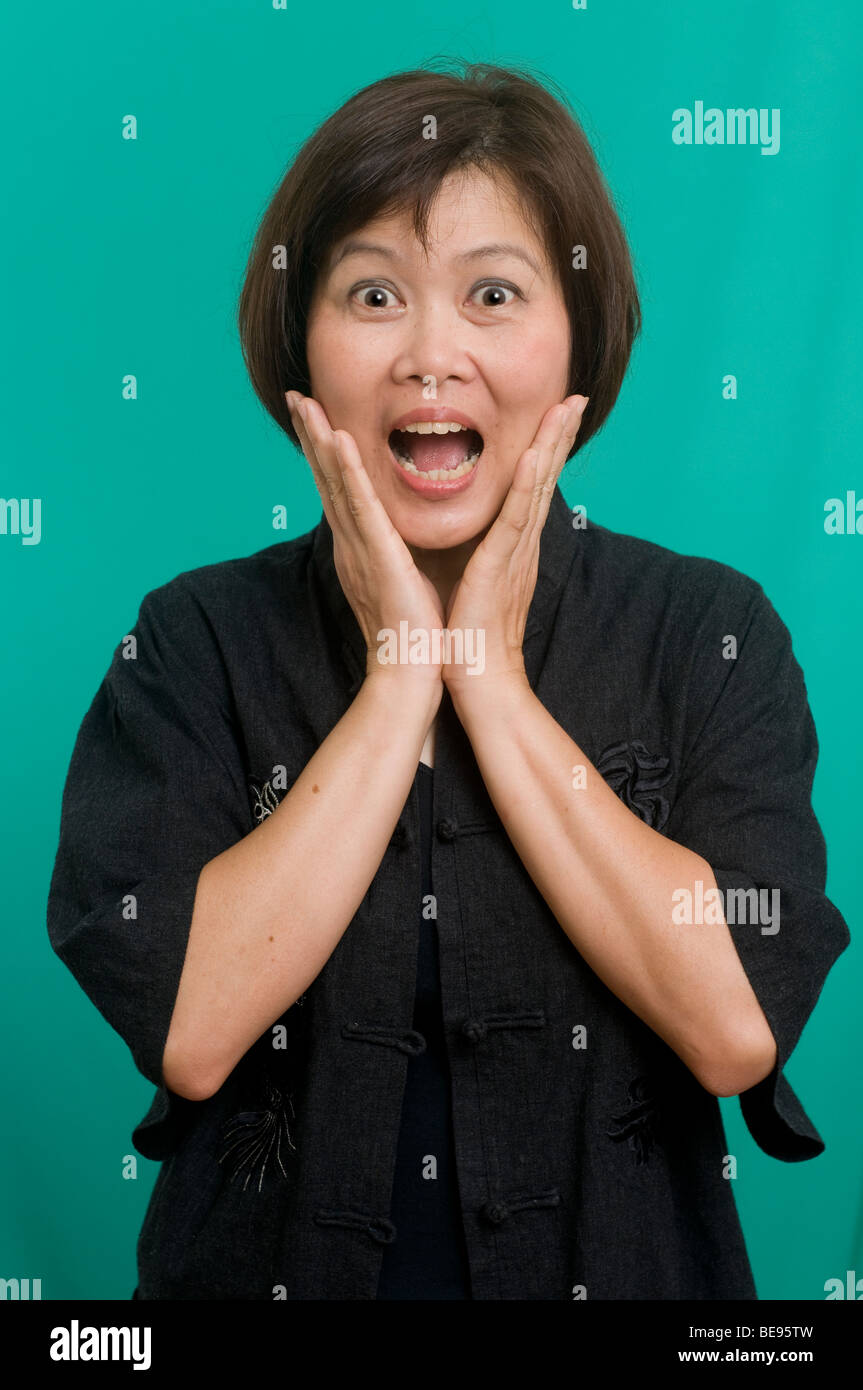 Attractive Asian woman showing look of surprise Stock Photo - Alamy
